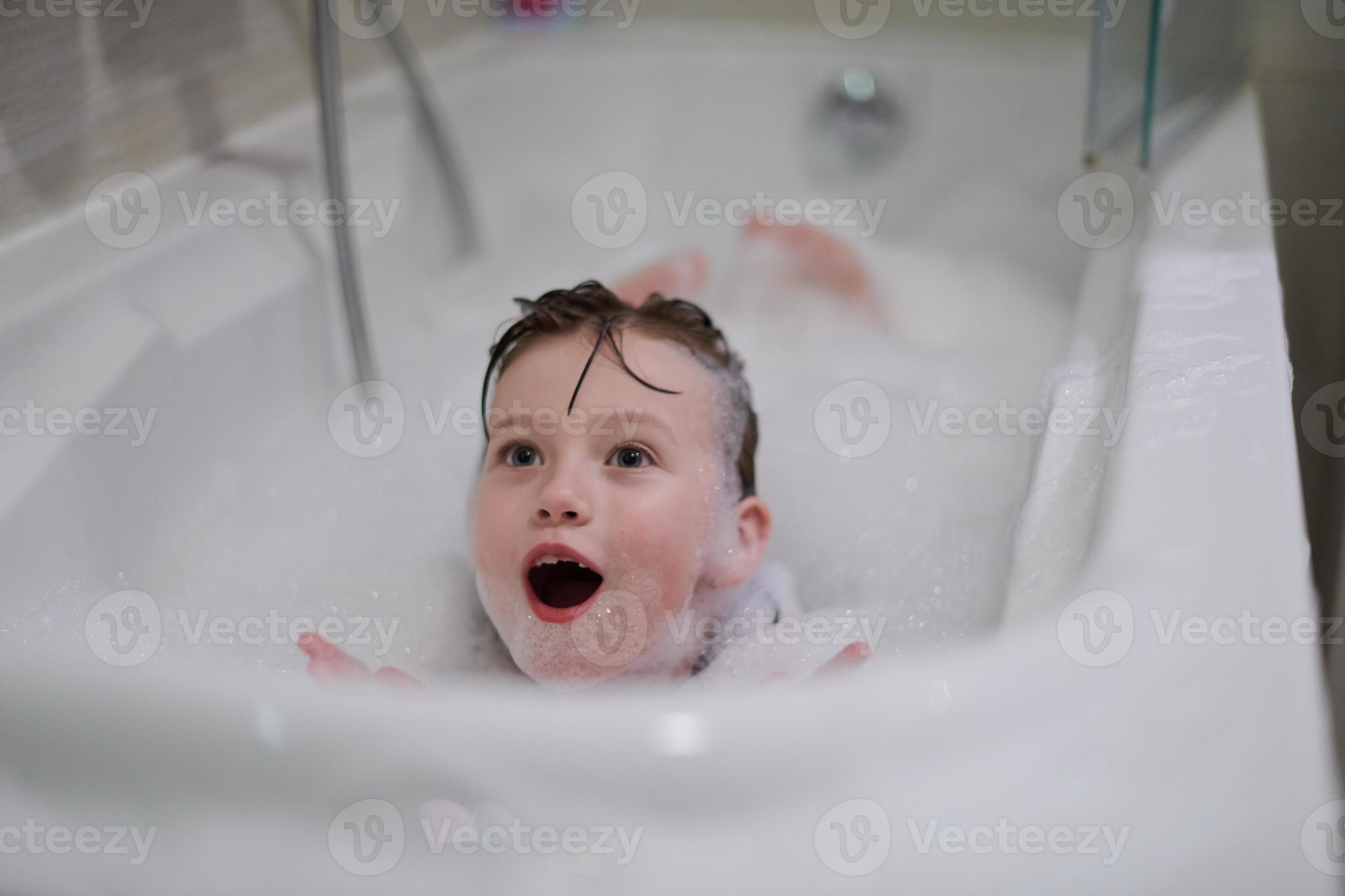 little girl in bath playing with soap foam 10707437 Stock Photo at Vecteezy