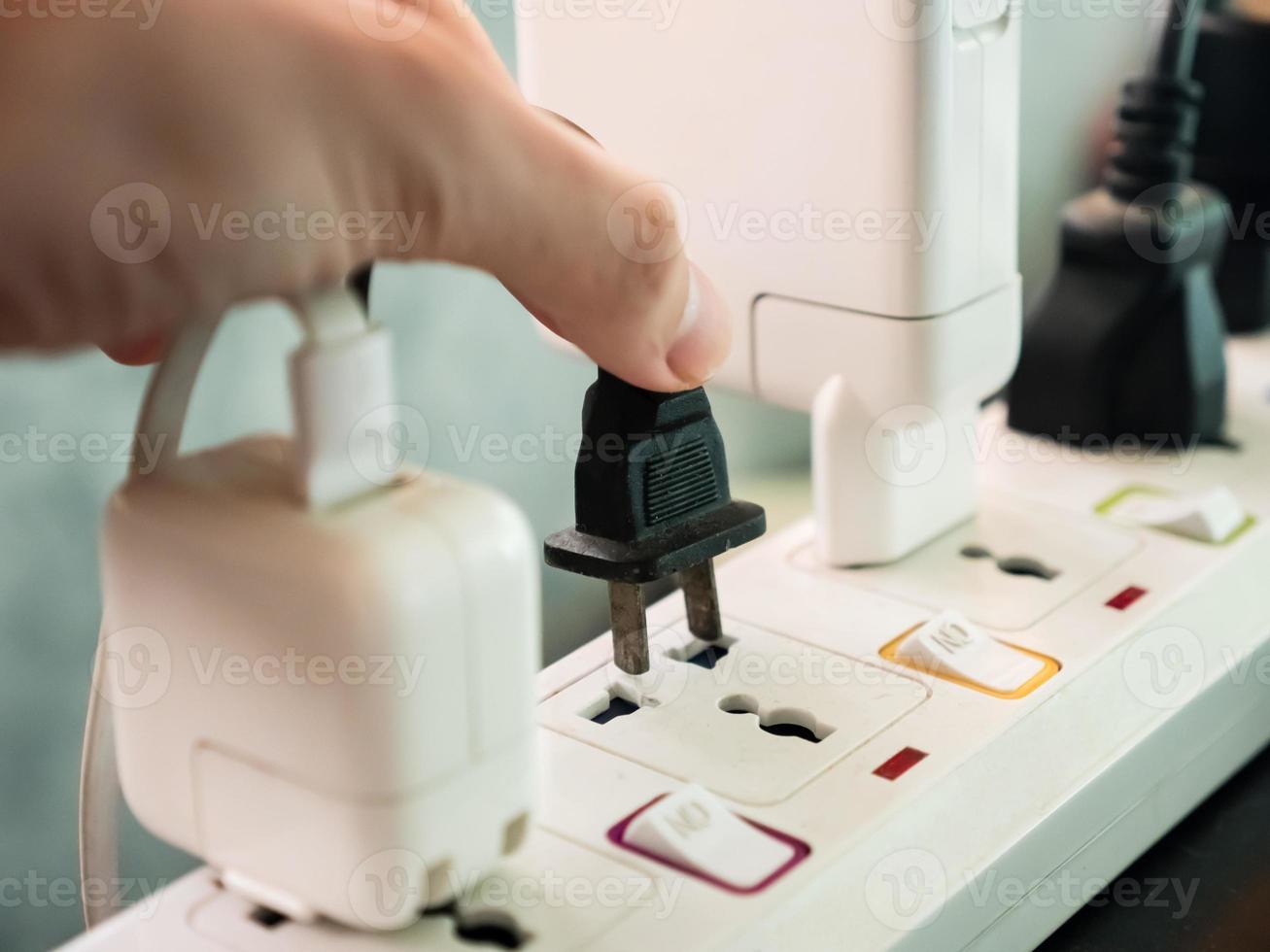 Hand holding electric plug, Multiple socket with connected plugs ... Hand holding electric plug, Multiple socket with connected plugs ...