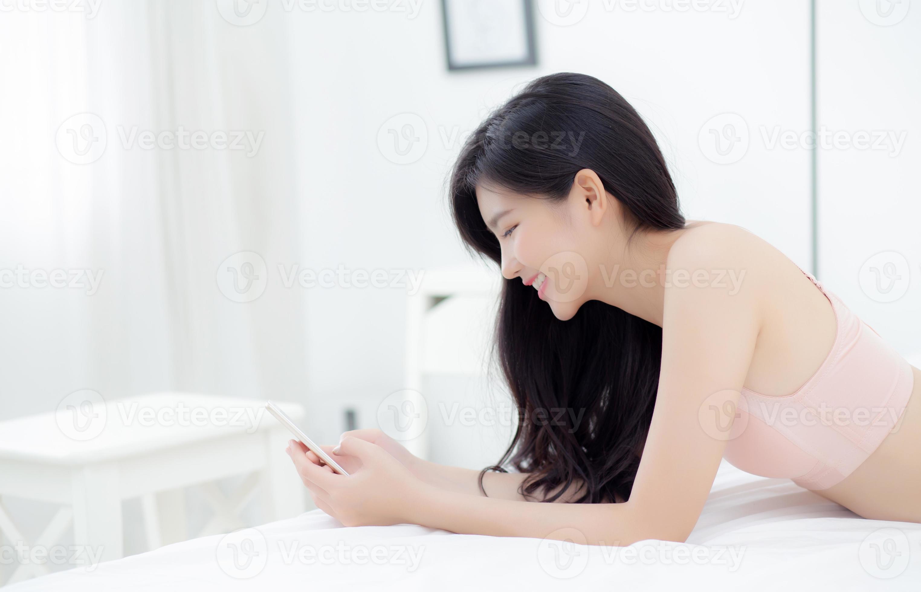 Beautiful Young Asian Woman Sexy In Underwear Chatting On Mobile Phone