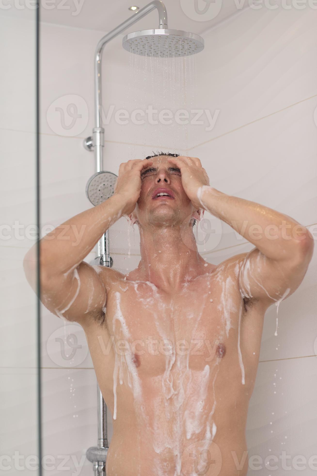 man taking shower in bath 10782752 Stock Photo at Vecteezy