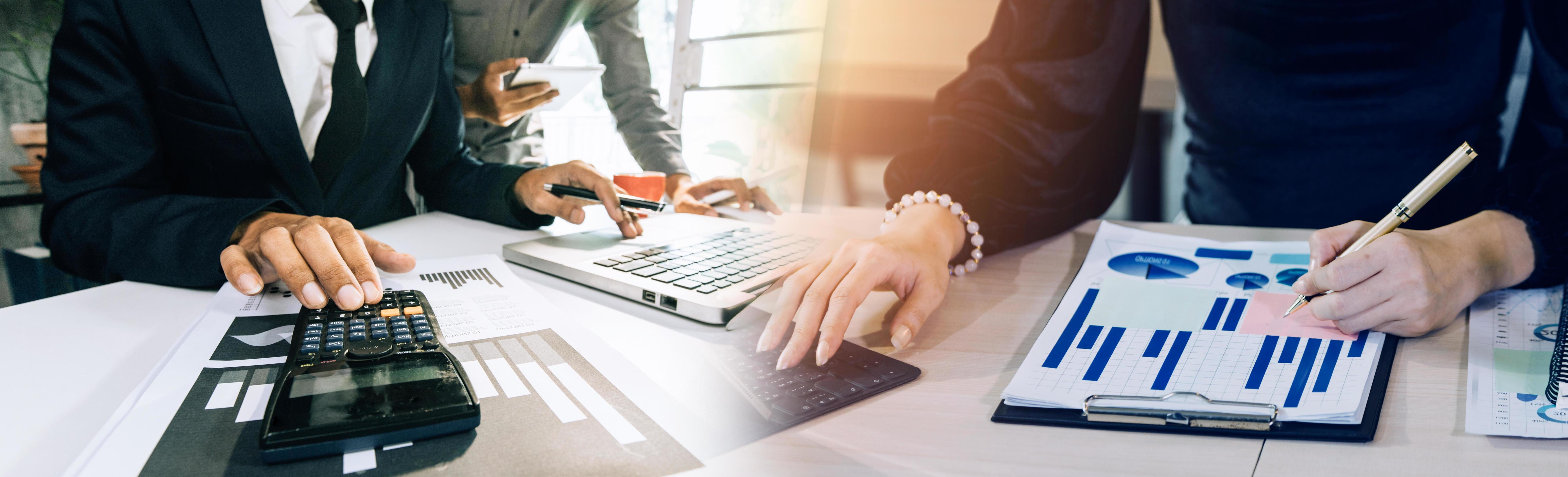 Business team finance or bookkeeper working with a calculator to ...