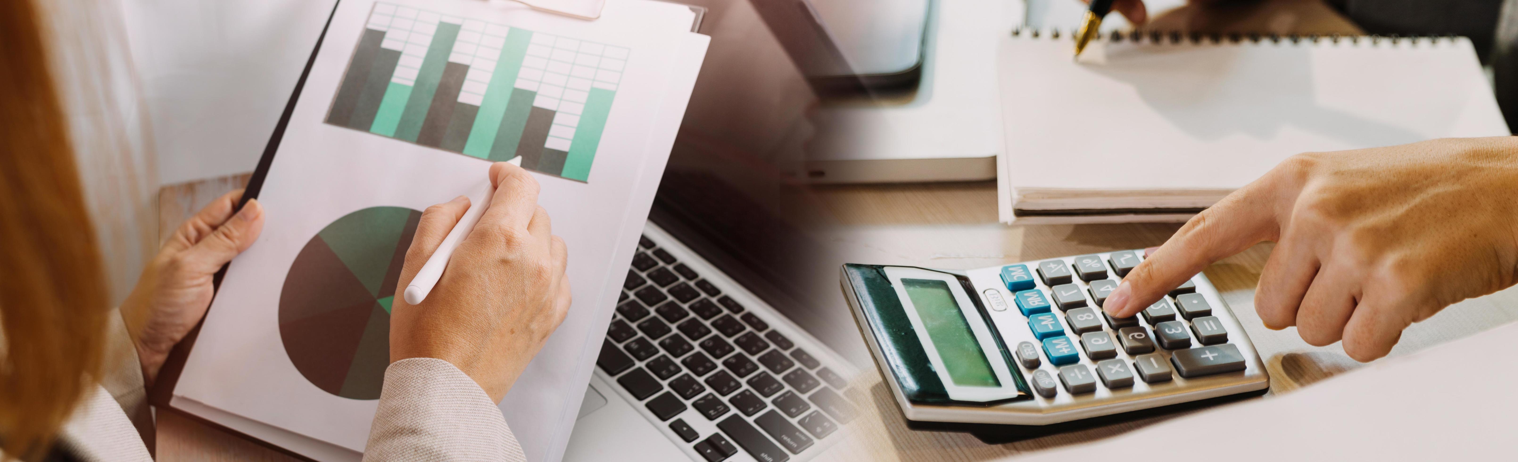 Business team finance or bookkeeper working with a calculator to ...