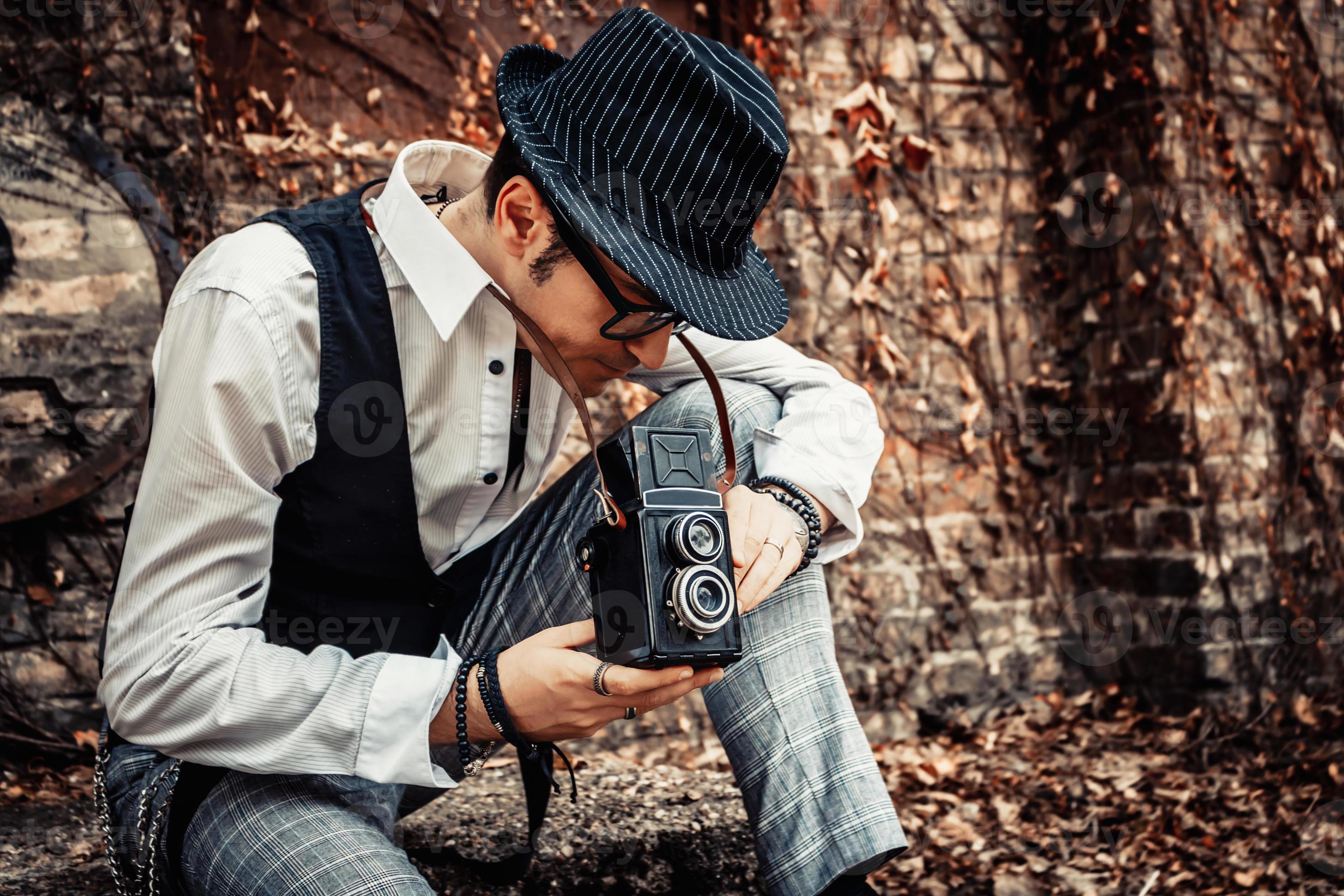 Photographer looking through visor of medium format camera. 10908562 Stock Photo at Vecteezy