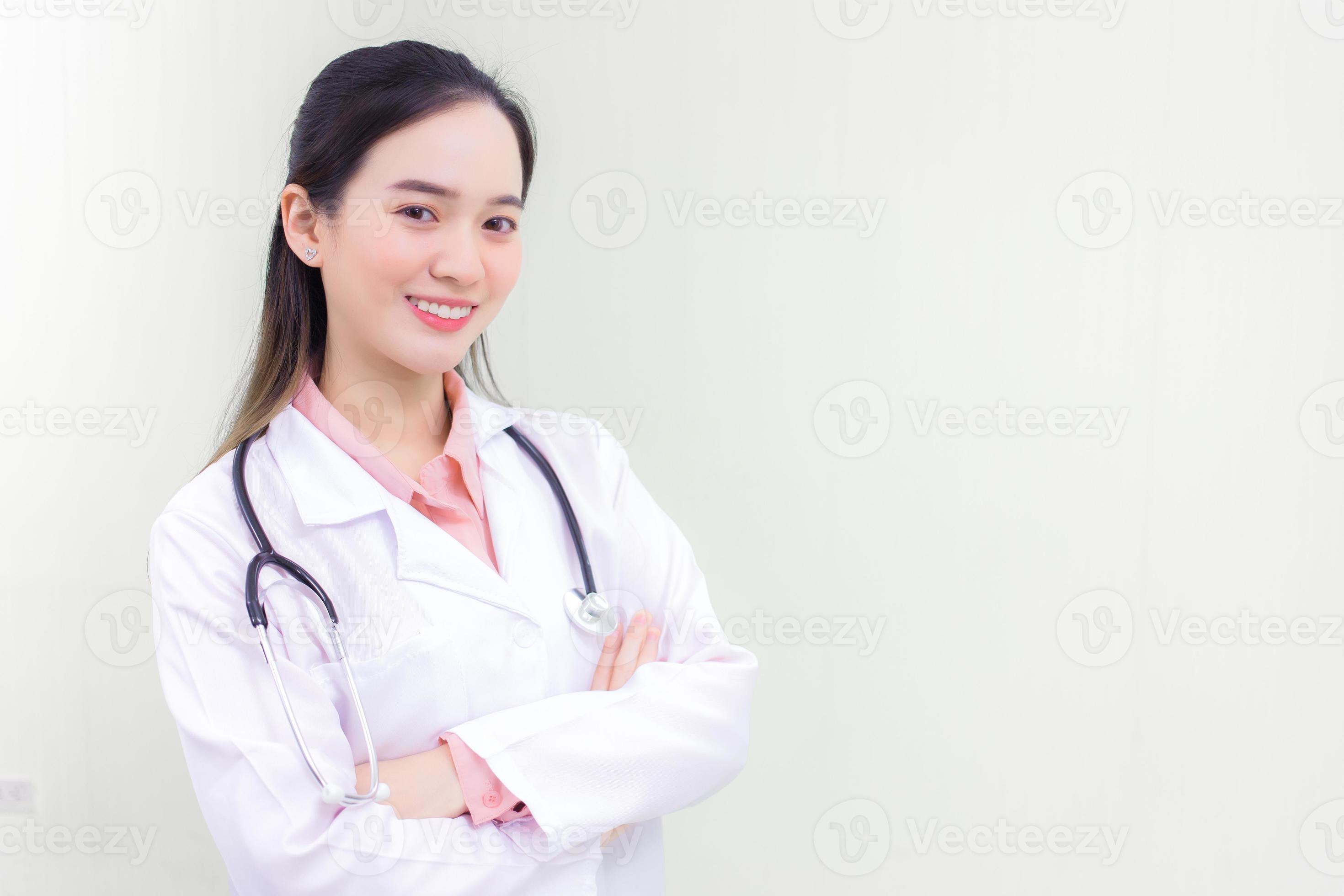 Young Beautiful Asian Woman Doctor Standing With Arms Crossed Happy And