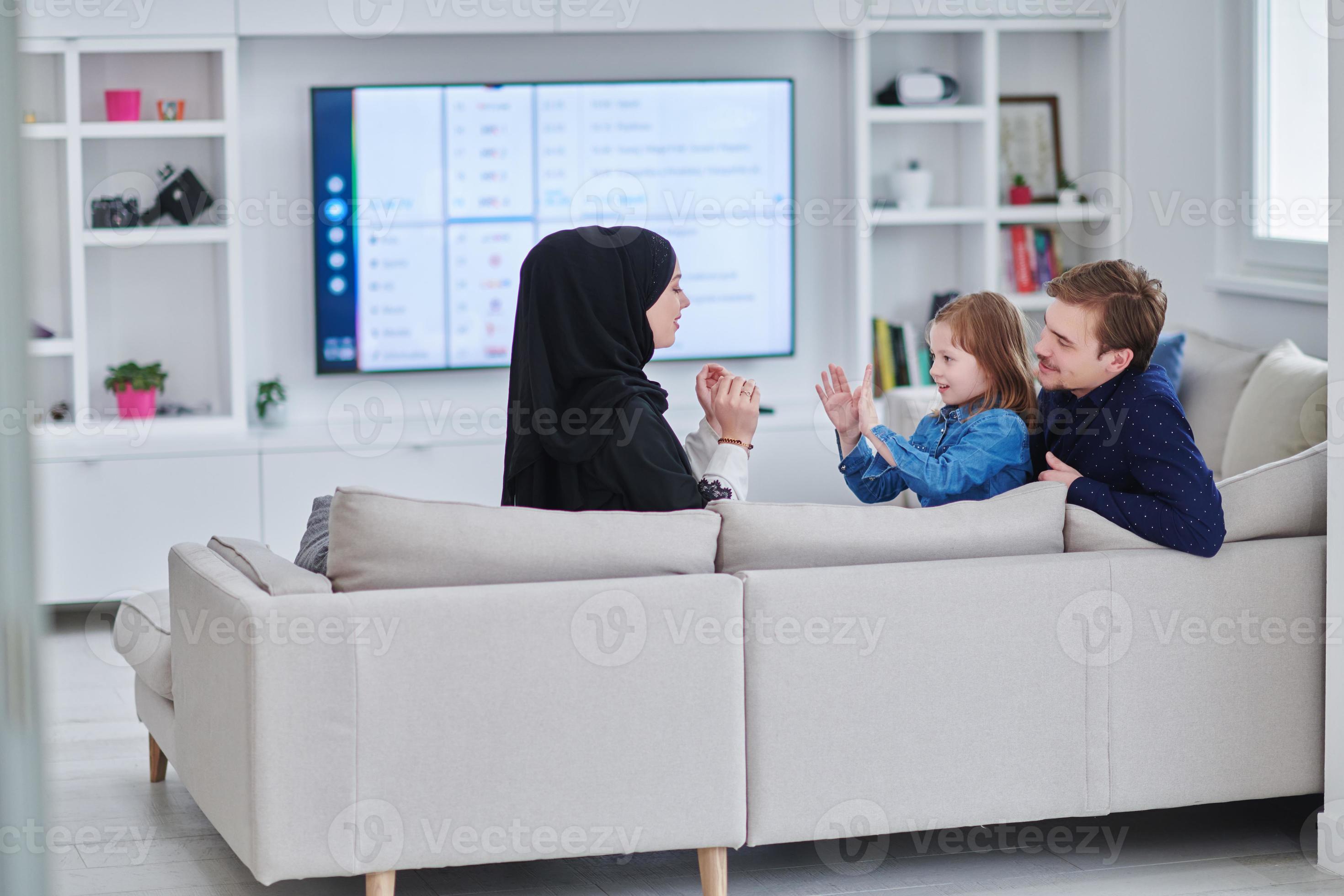 Happy Muslim family spending time together in modern home 10992486 Stock Photo at Vecteezy