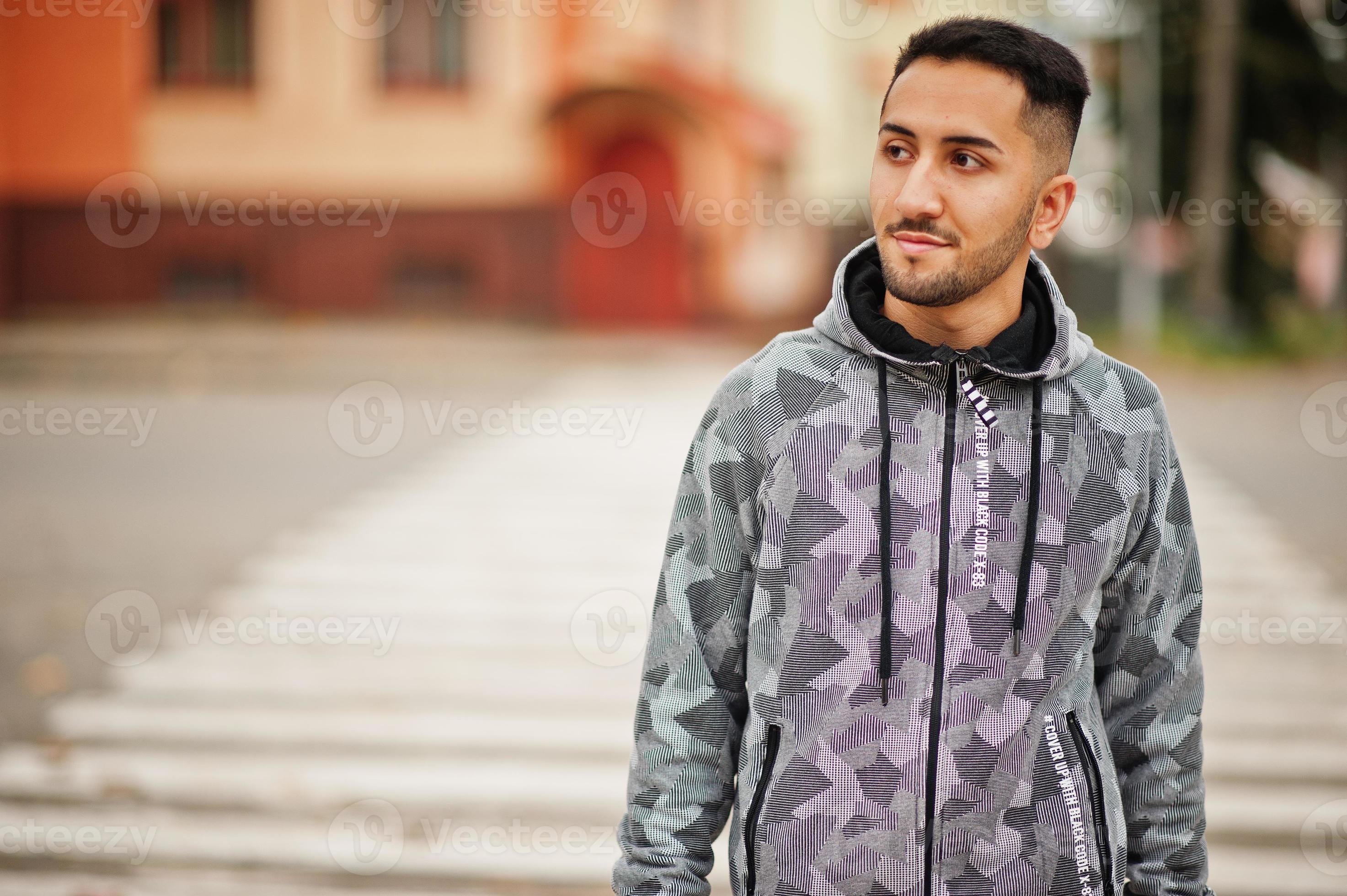 Student kuwaiti man wear at hoodie, walking crosswalk. 11012053 Stock Photo at Vecteezy