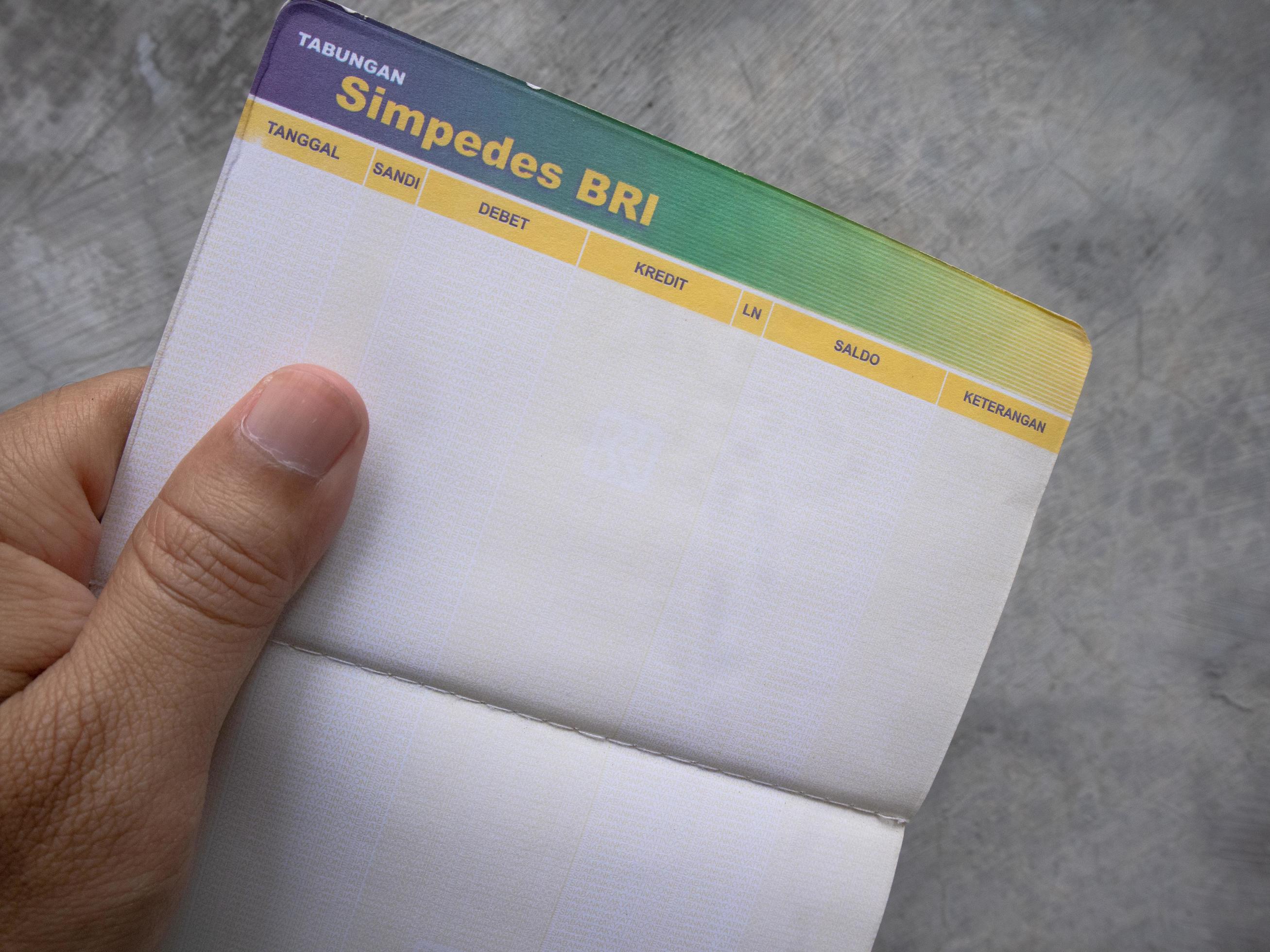 Sidoarjo, Jawa timur, Indonesia, 2022 - a man holding a bri simpedes bank passbook open 11022648 ...