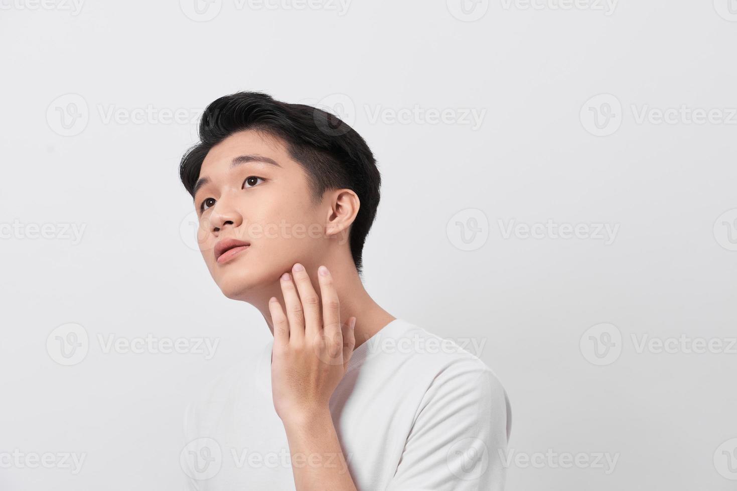 Young man touching his face, 11137716 Stock Photo at Vecteezy Young man touching his face, 11137716 Stock Photo at Vecteezy