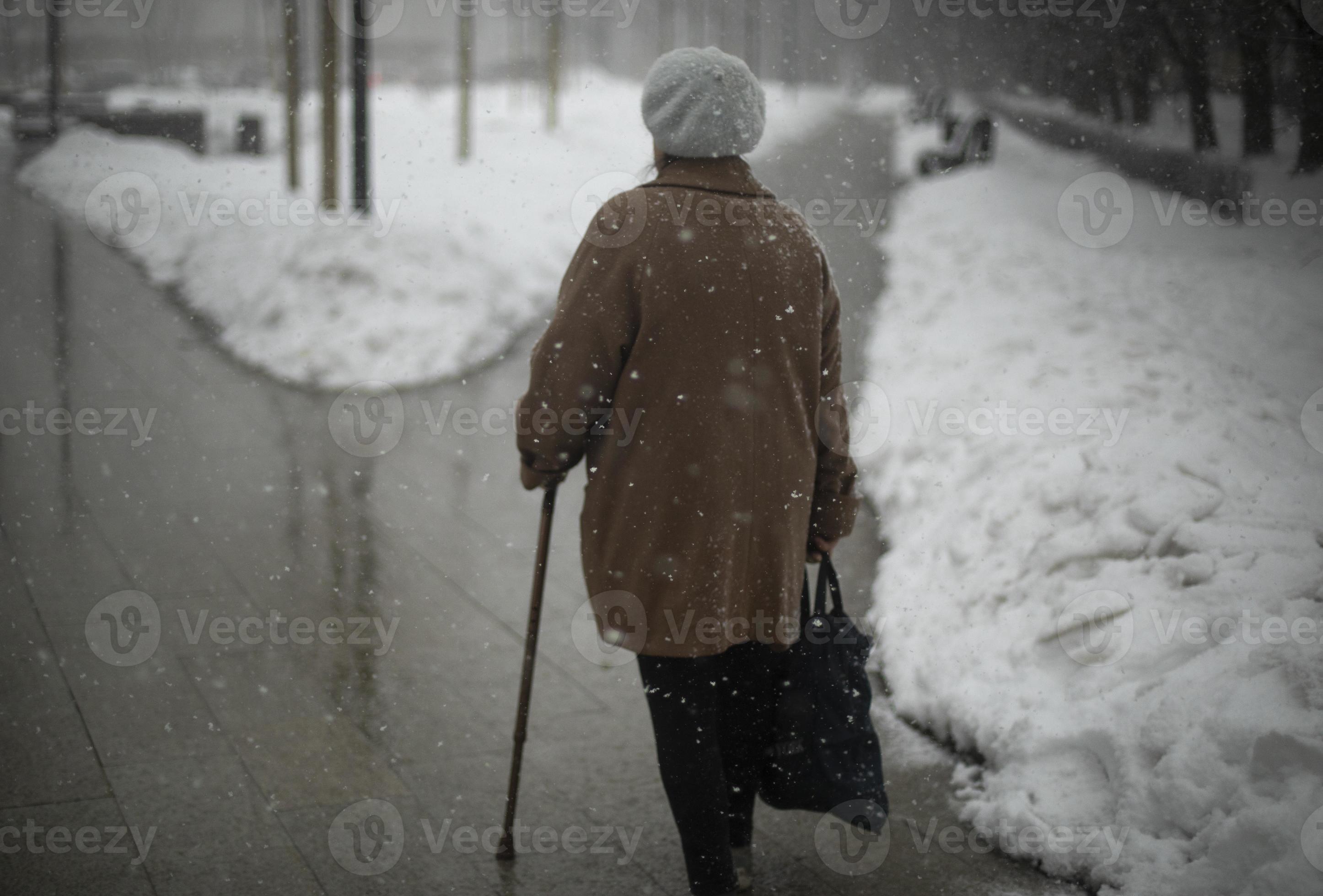 Woman With Walking Stick Pensioner Walks Down Road Grandmother On