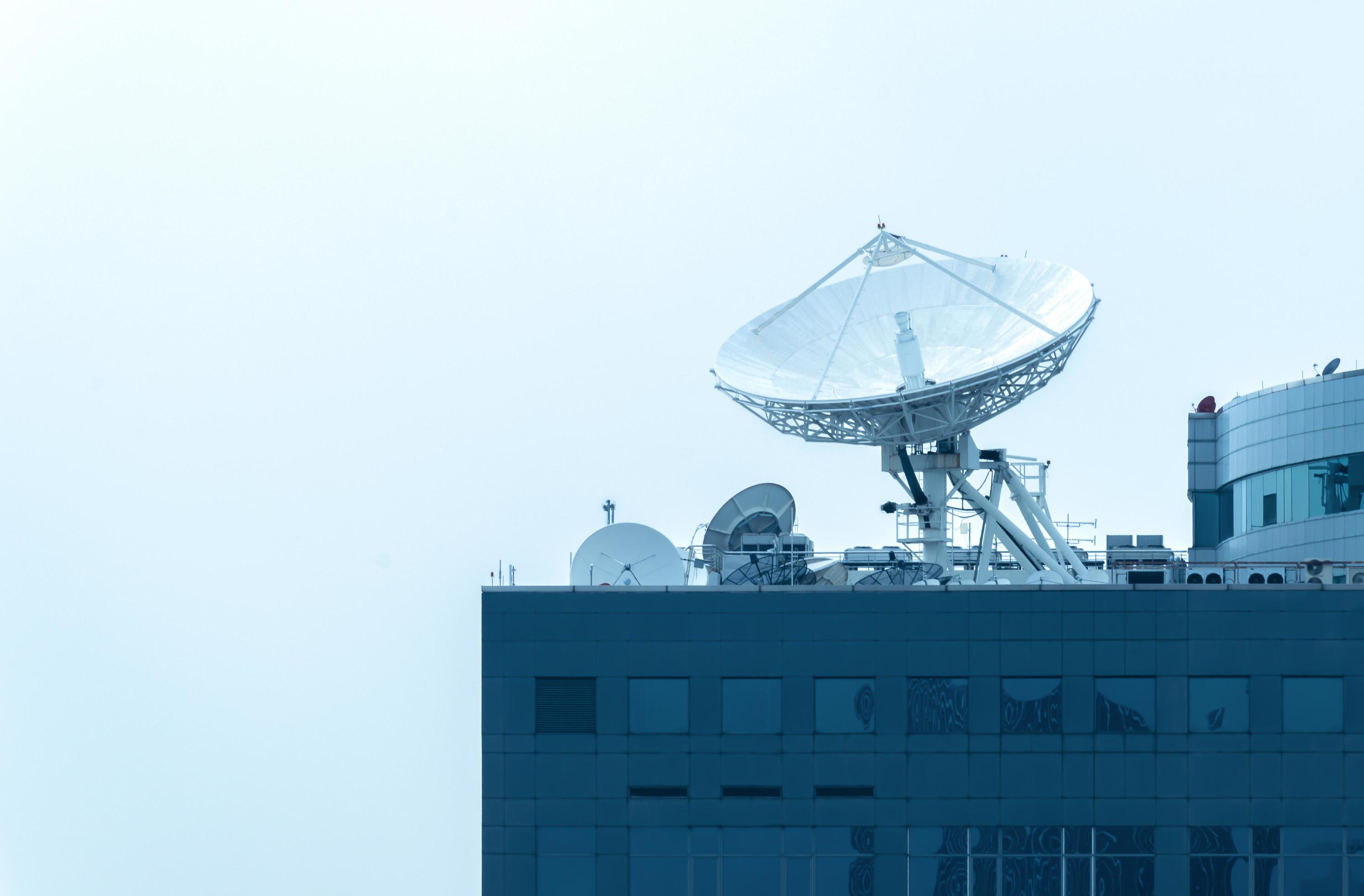 Large satellite dish on rooftop building 11174542 Stock Photo at Vecteezy