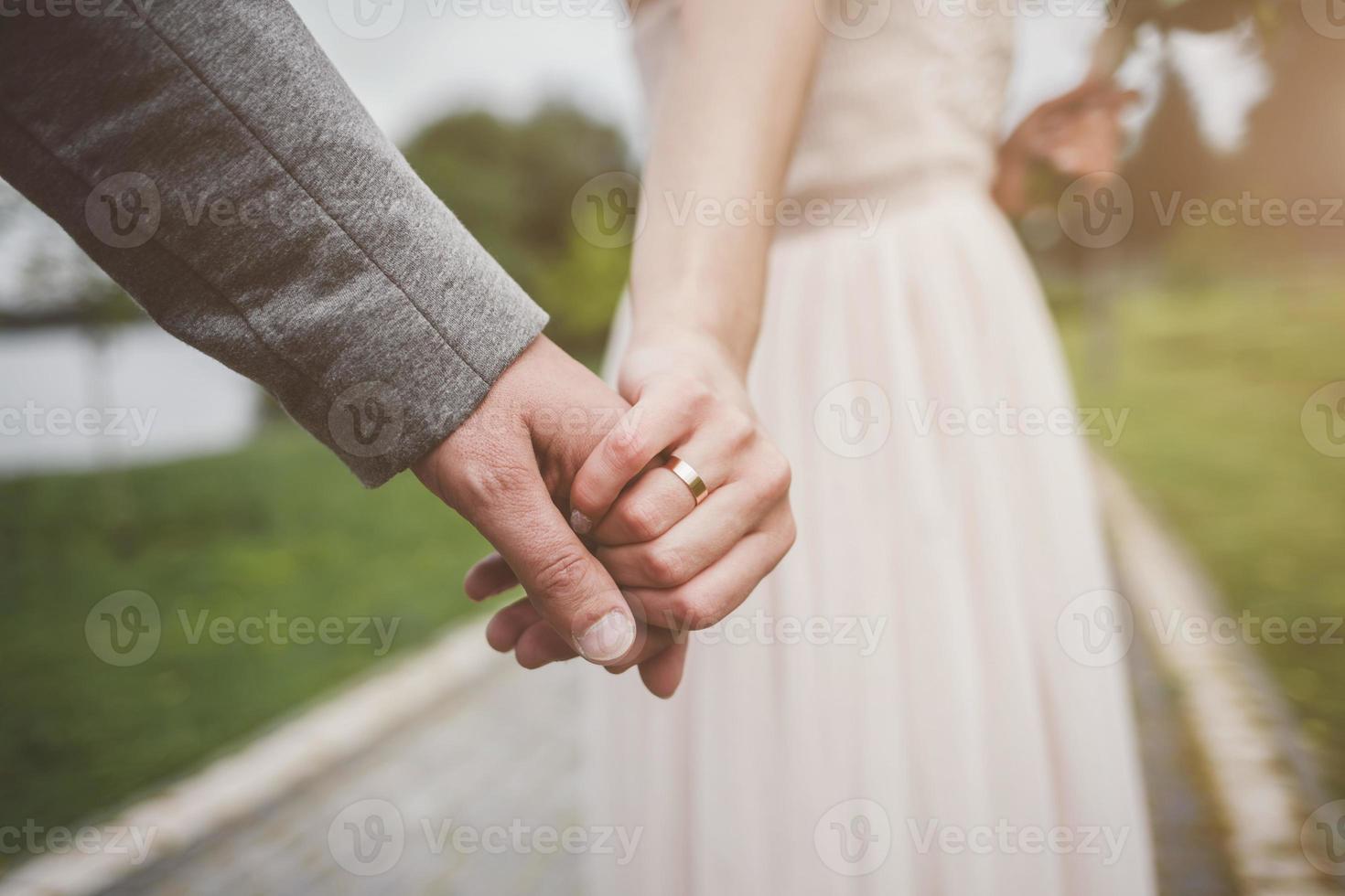 Bride and groom holding hands 11250729 Stock Photo at Vecteezy