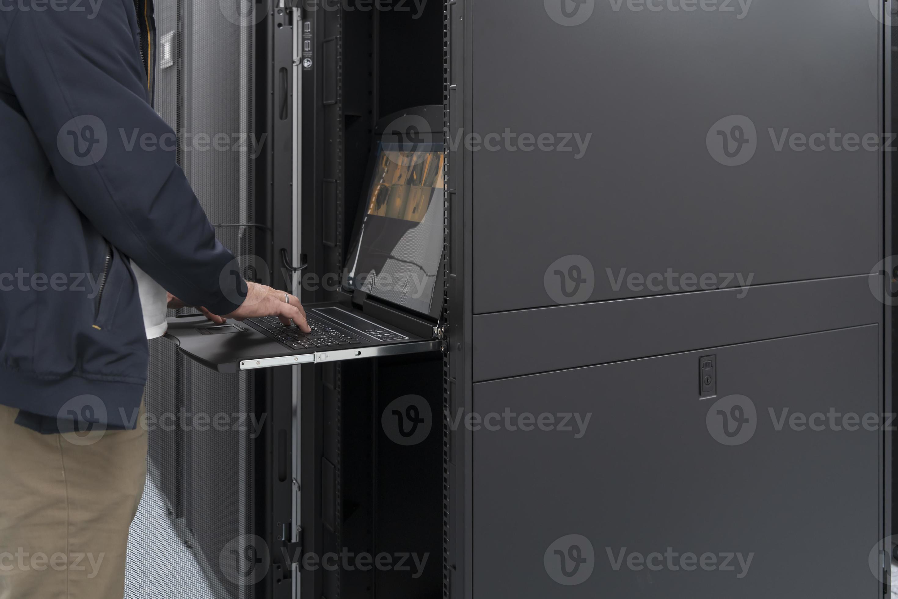 Close Up On Data Center Engineer Hands Using Keyboard On A