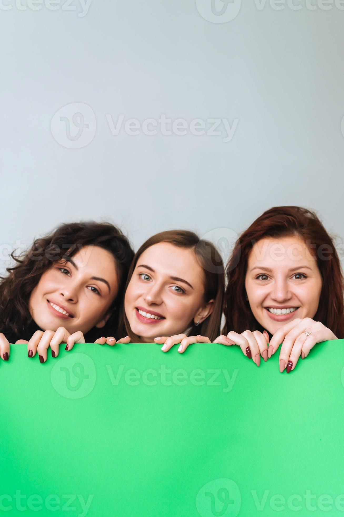 Three beautiful young girls posing for the camera 11364115 Stock Photo ...
