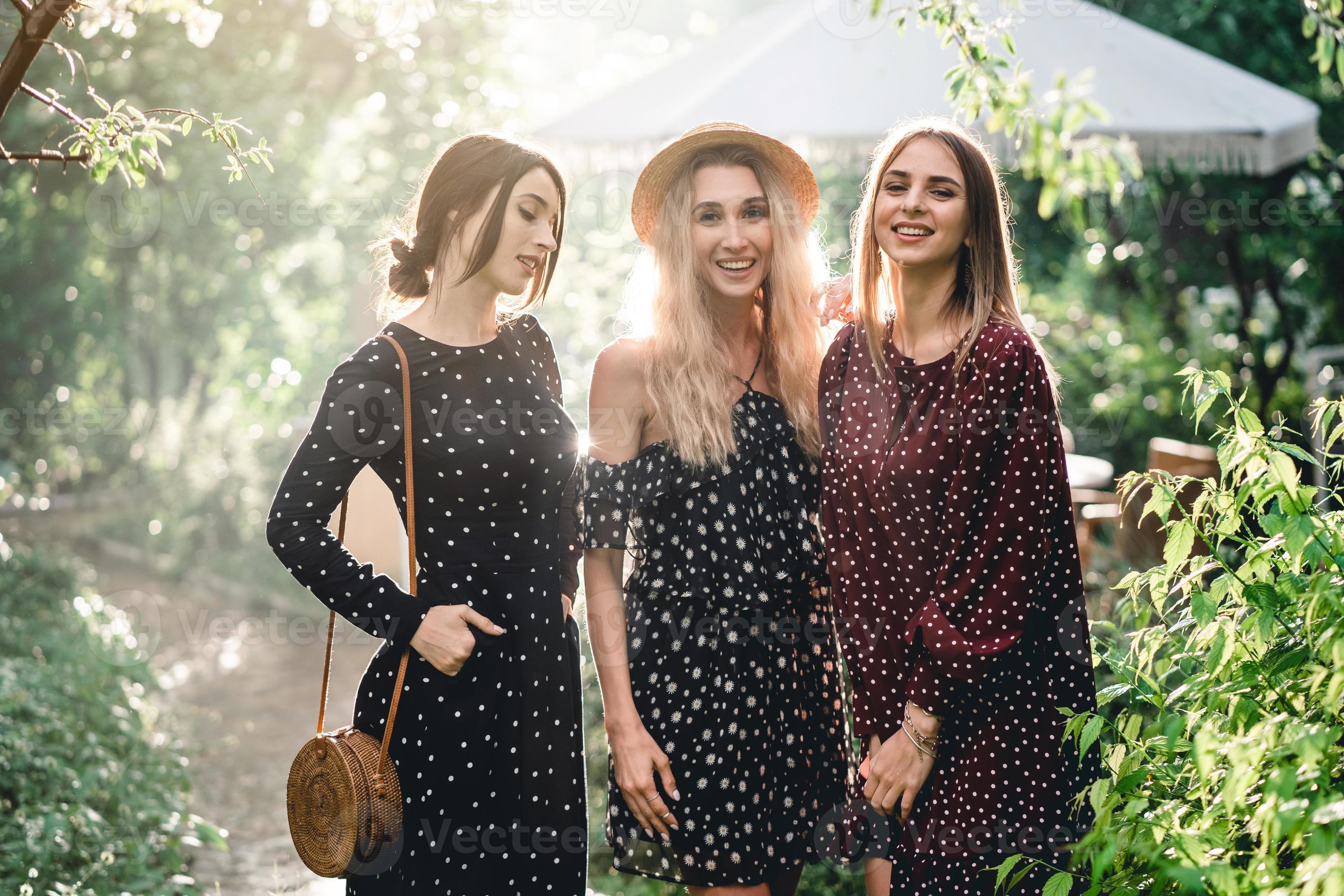 Three girls are photographed on camera 11459359 Stock Photo at Vecteezy