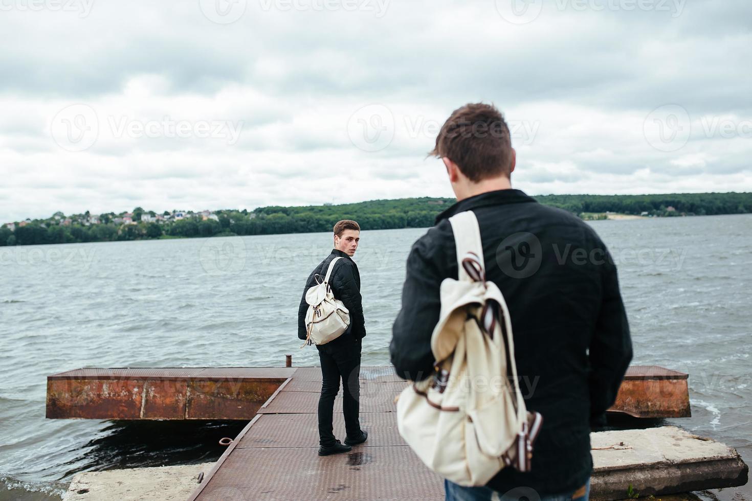 two young guys standing on a pier 11484958 Stock Photo at Vecteezy two young guys standing on a pier 11484958 Stock Photo at Vecteezy