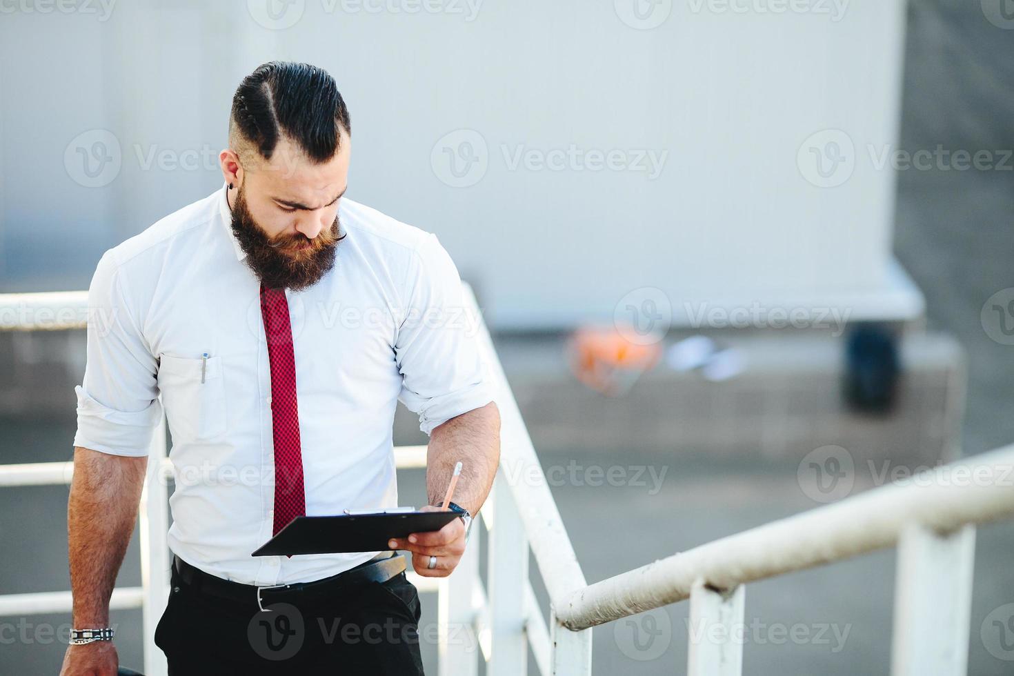 businessman stands with documents in hand 11516407 Stock Photo at Vecteezy businessman stands with documents in hand 11516407 Stock Photo at Vecteezy