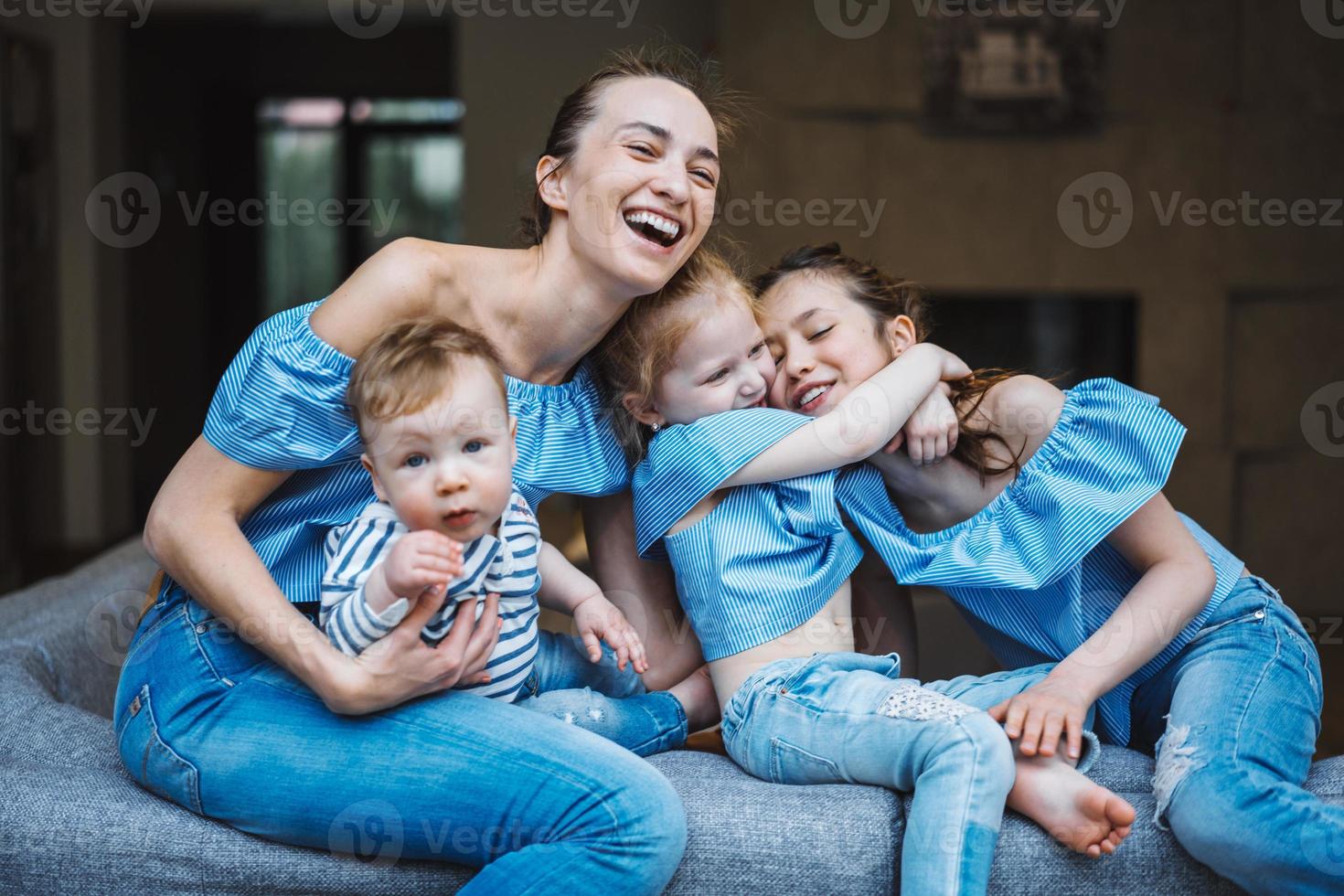 Mom, two daughters and a little son on the couch 11527386 Stock Photo ...