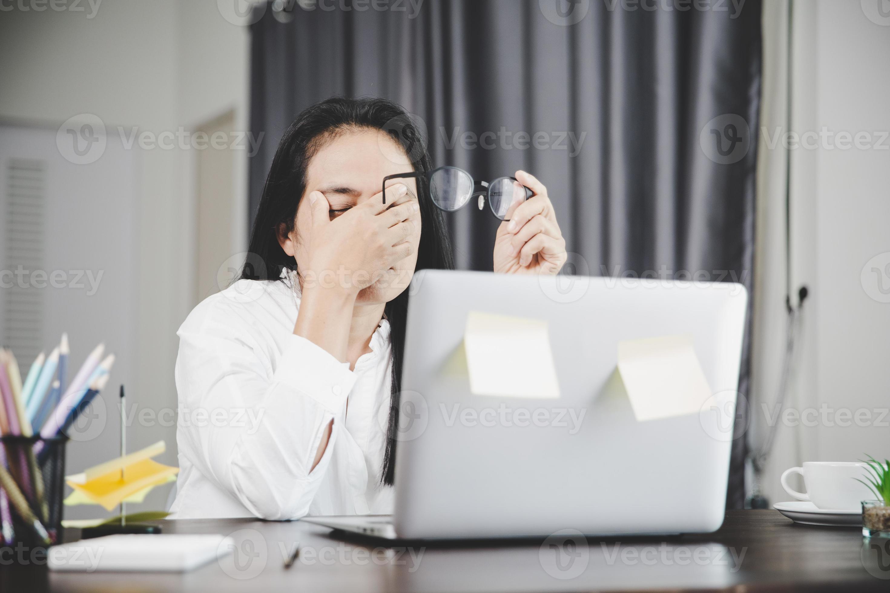 Young business woman person sleepy and has frustration eye problems ...