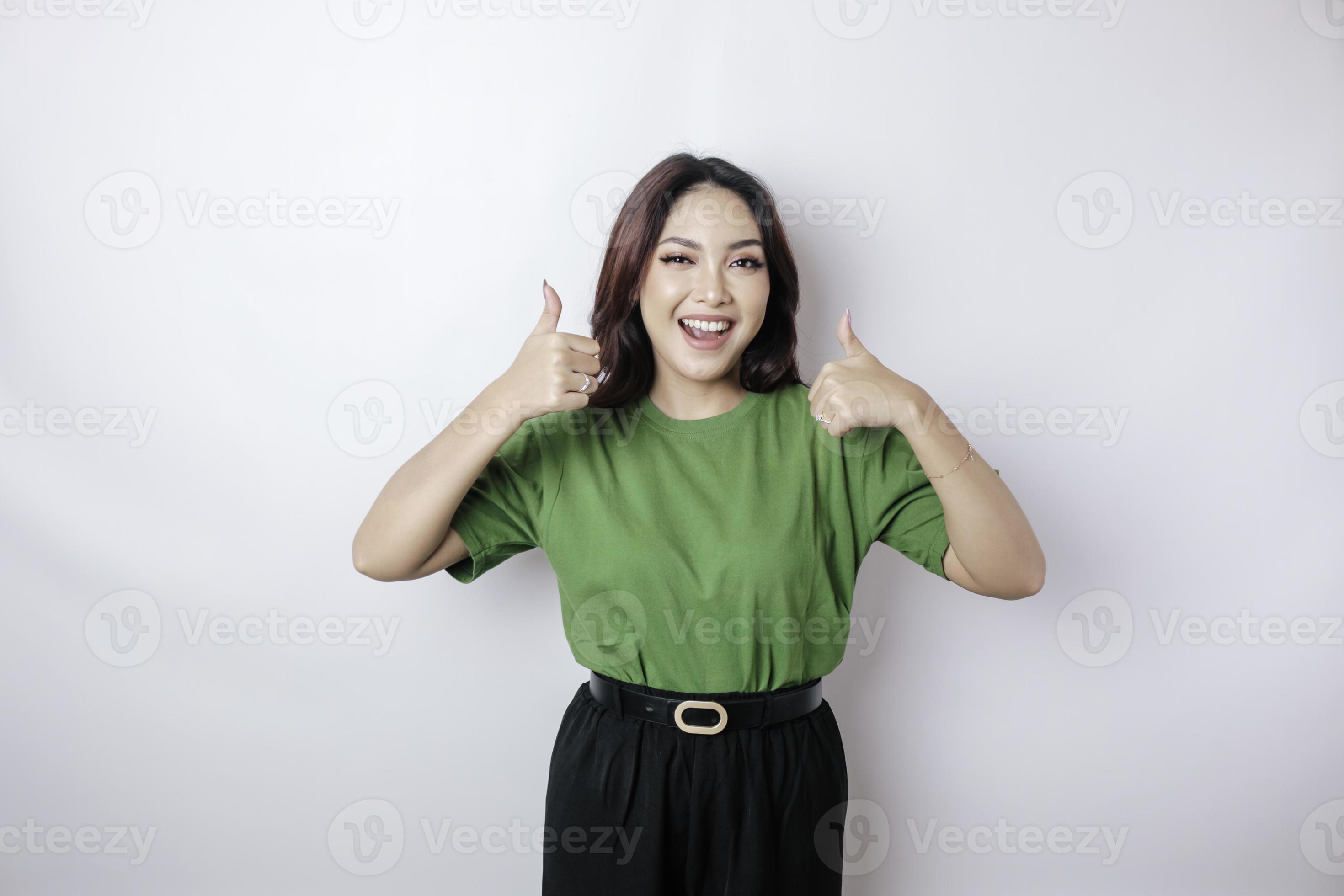 Excited Asian woman gives thumbs up hand gesture of approval, isolated ...