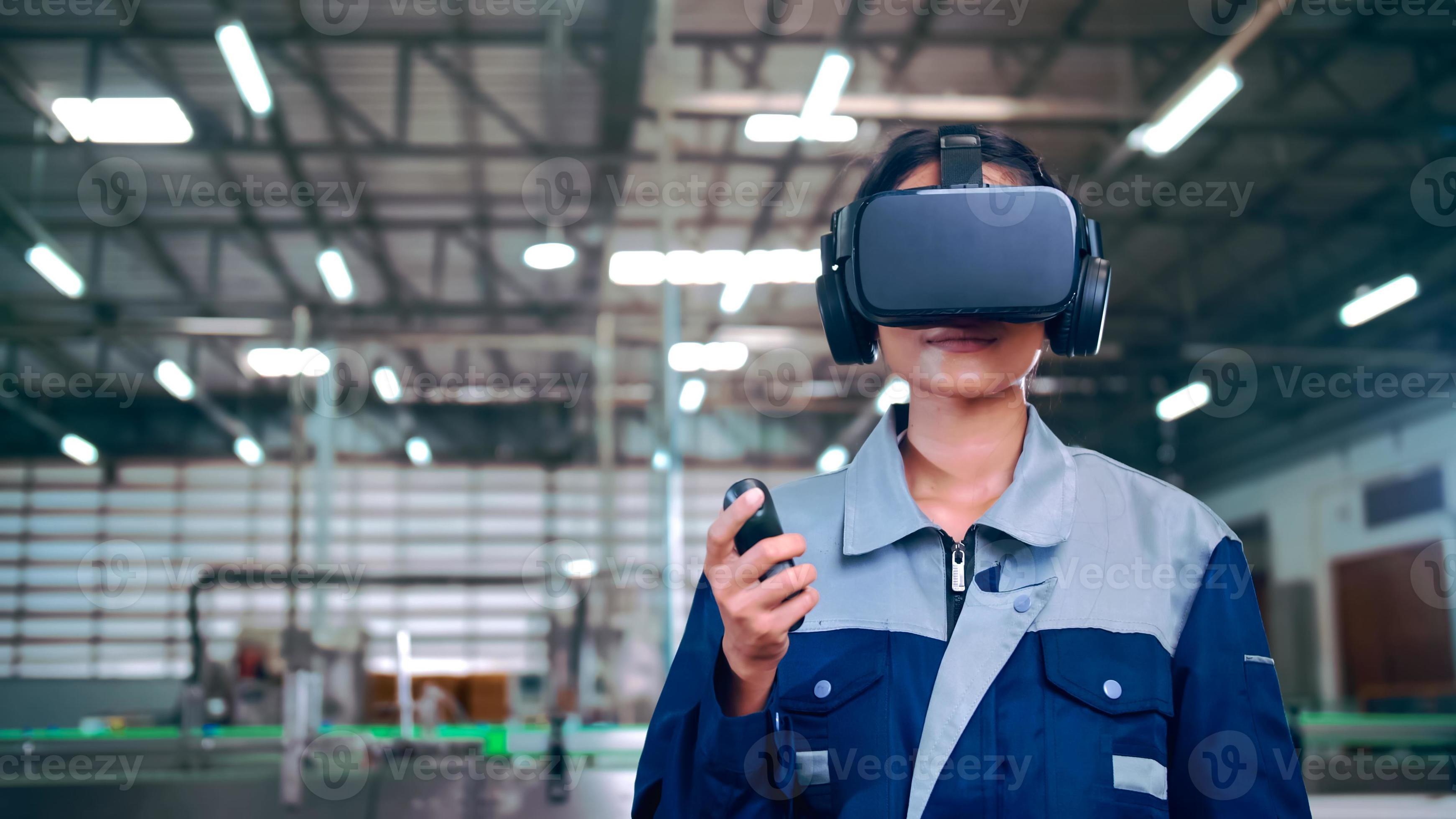 Engineer is using virtual reality glasses to inspect the factory's mechanical control system ...
