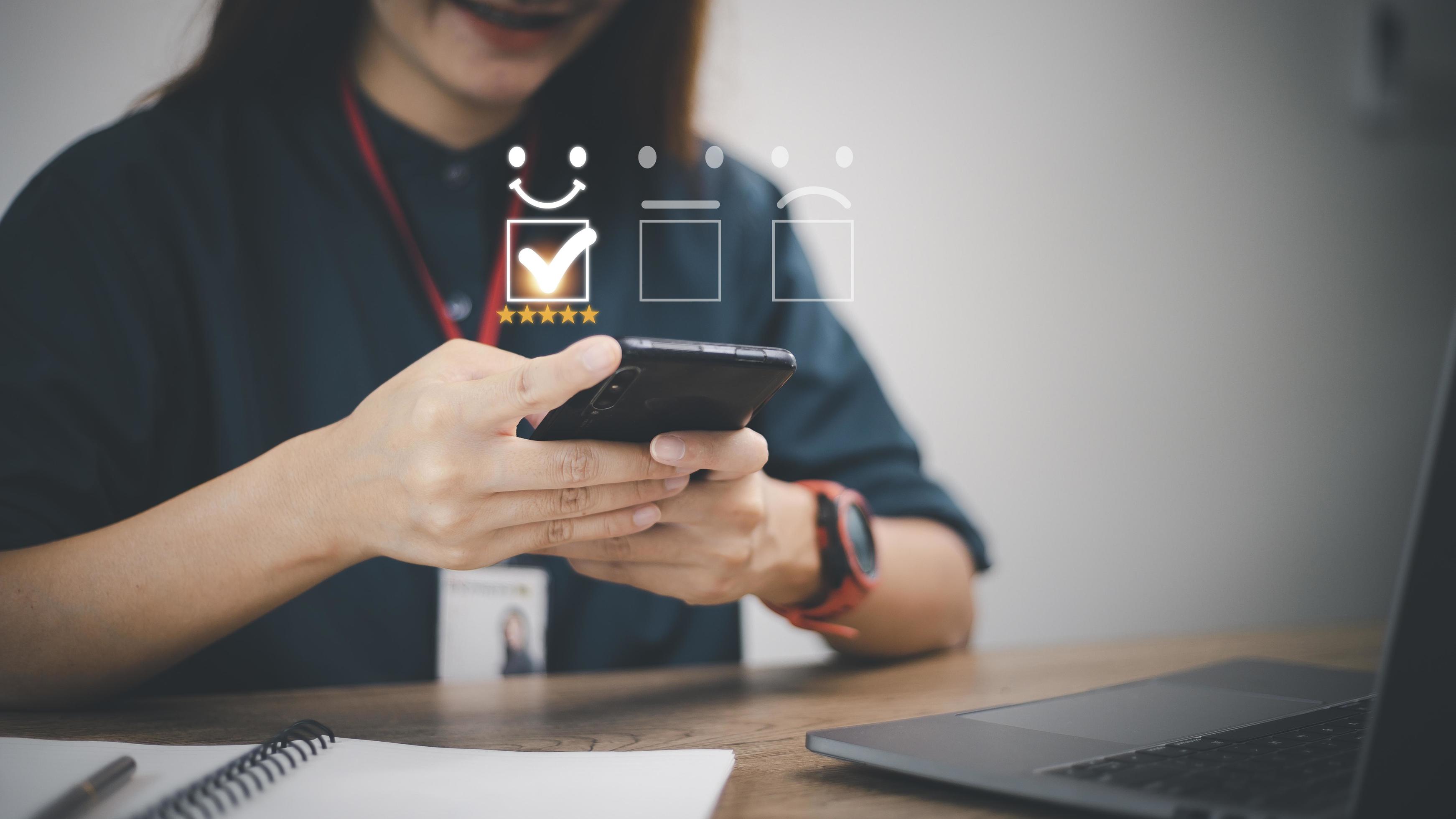 Customer service evaluation concept. smiling Asian female Is using a ...