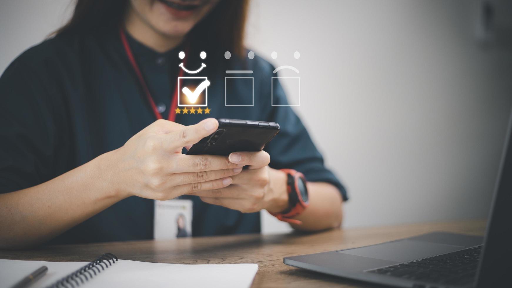 Customer service evaluation concept. smiling Asian female Is using a ...