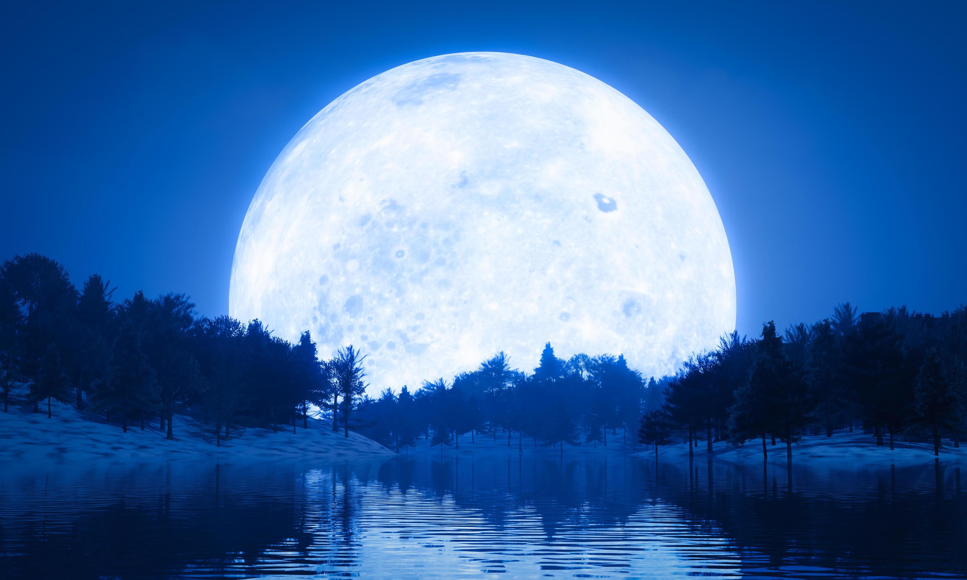 Super Full moon blue light. Lake, pine forest, snowy ground, shadow of the moon reflected in the ...