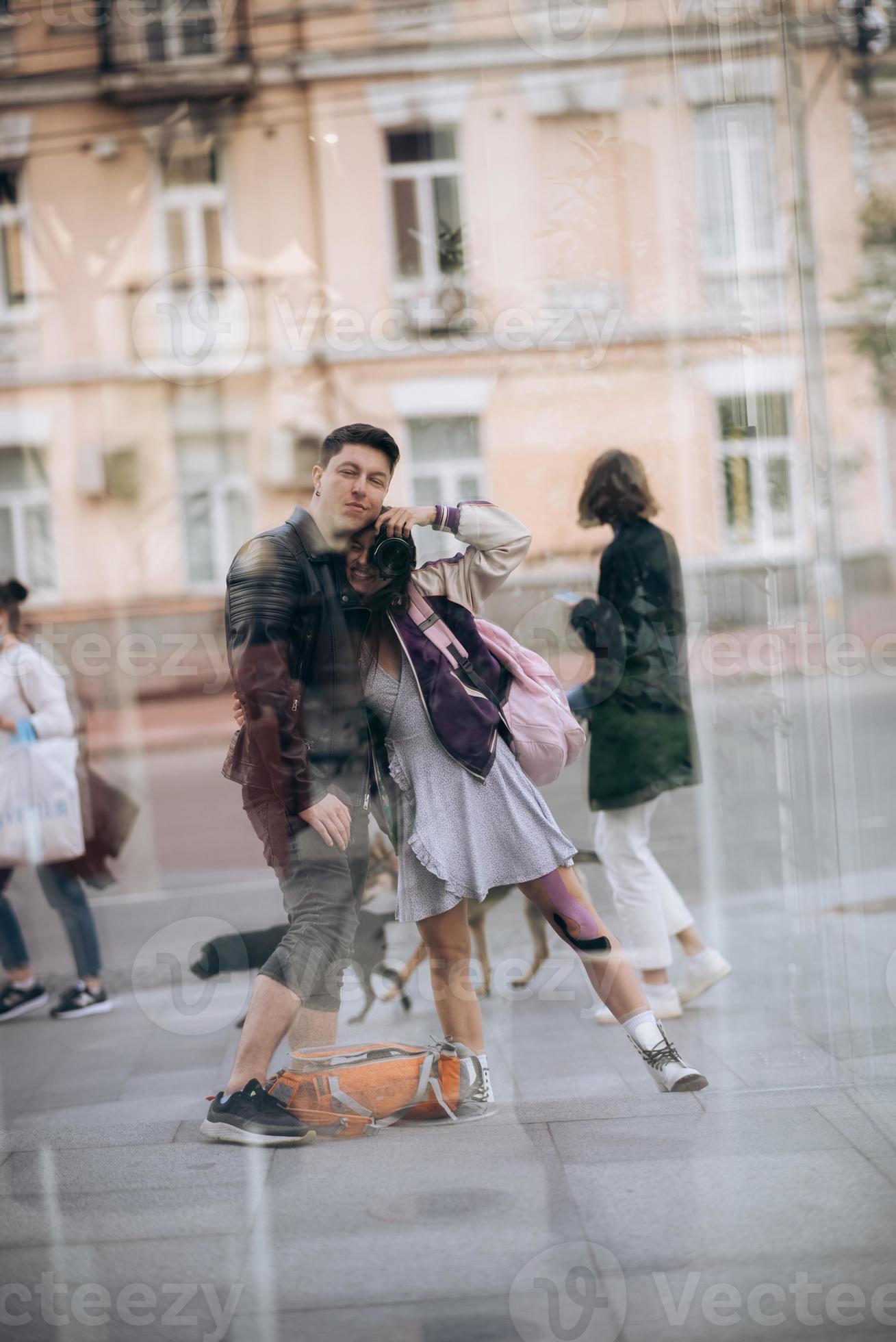 Young Couple Taking Selfie In Reflection Of Glass Building 11738566