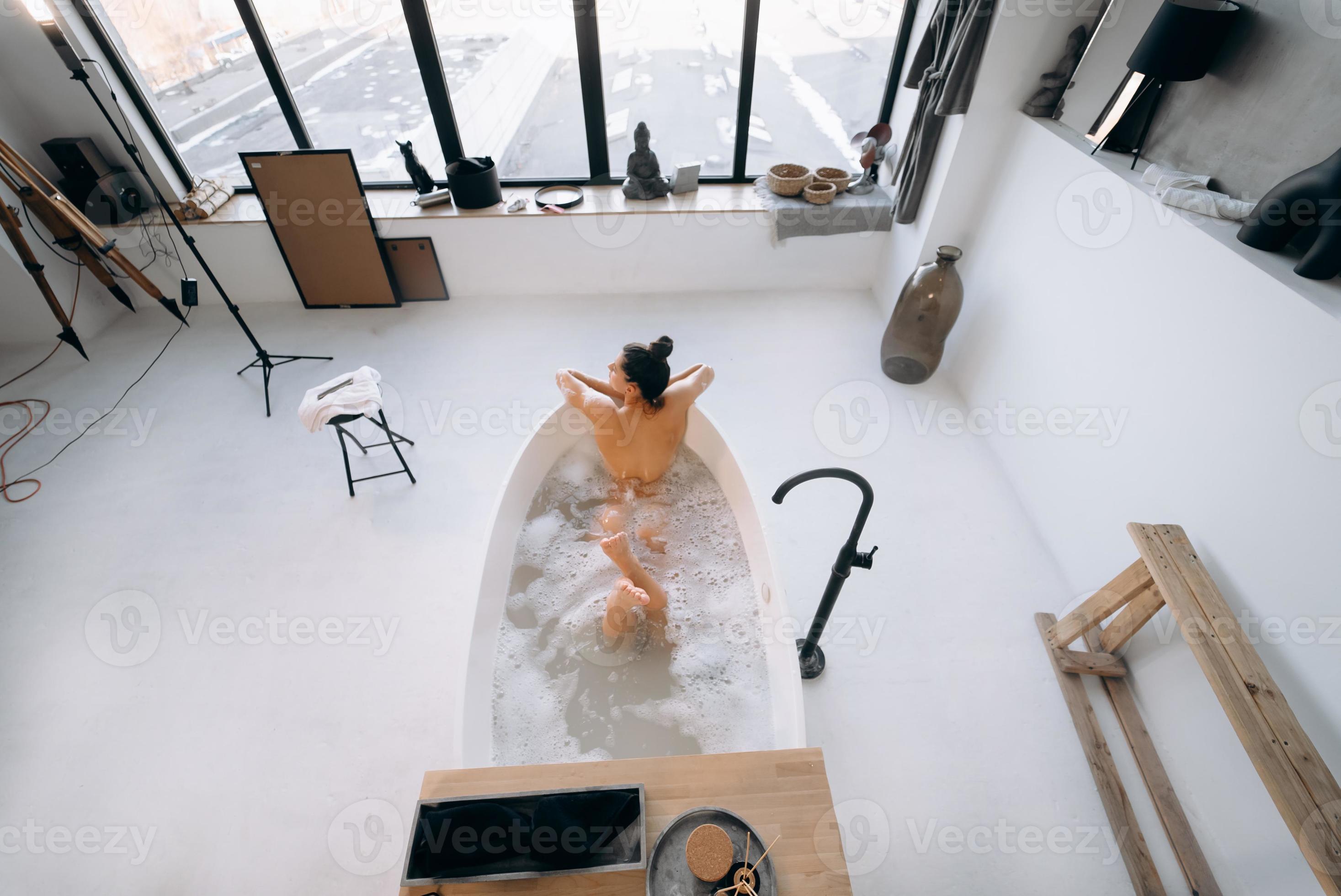Relaxed Lady Taking Bath Enjoying And Relaxing While Lying In Bathtub