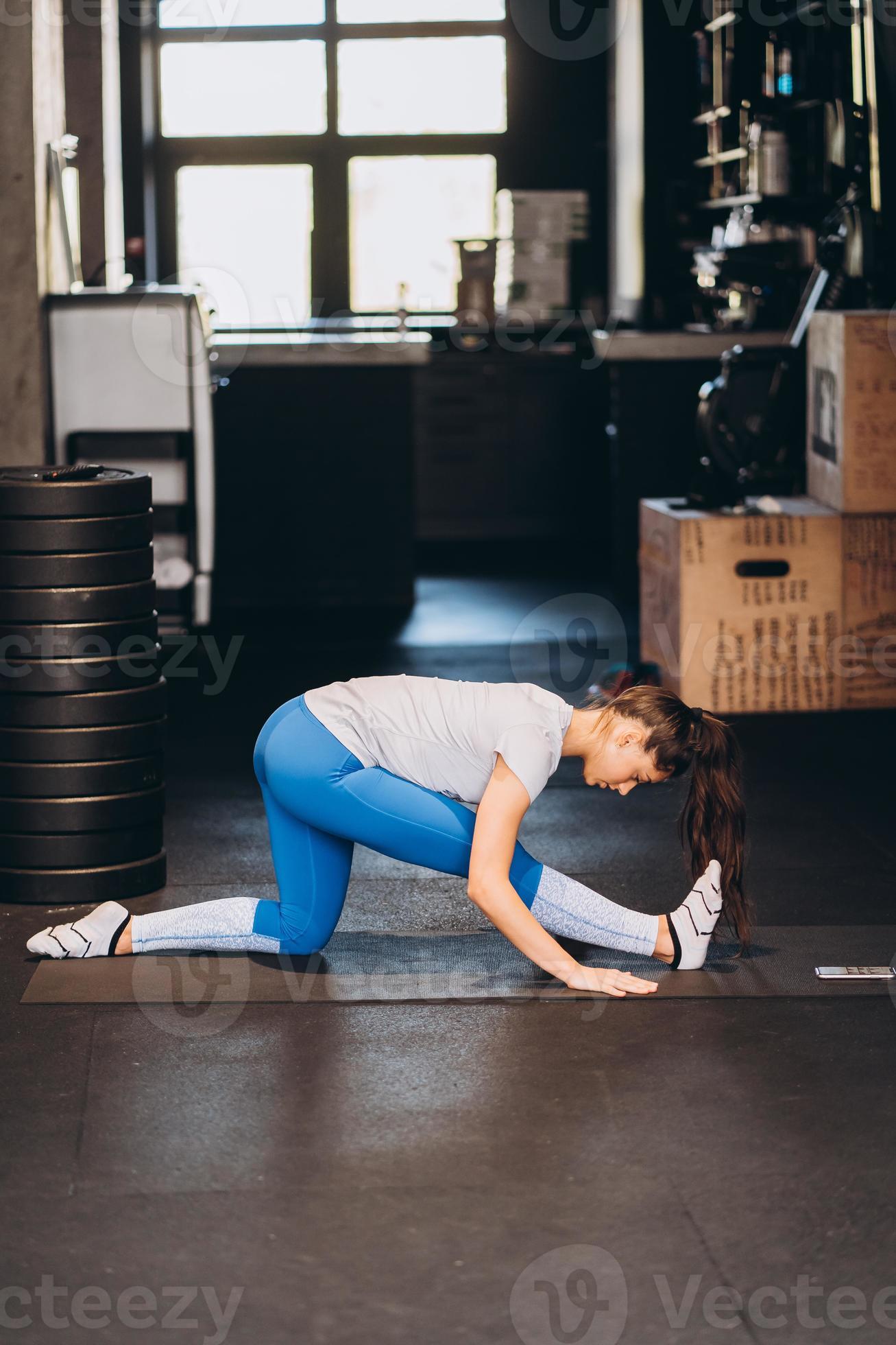 Portrait of attractive young woman doing yoga or pilates exercise ... Portrait of attractive young woman doing yoga or pilates exercise ...