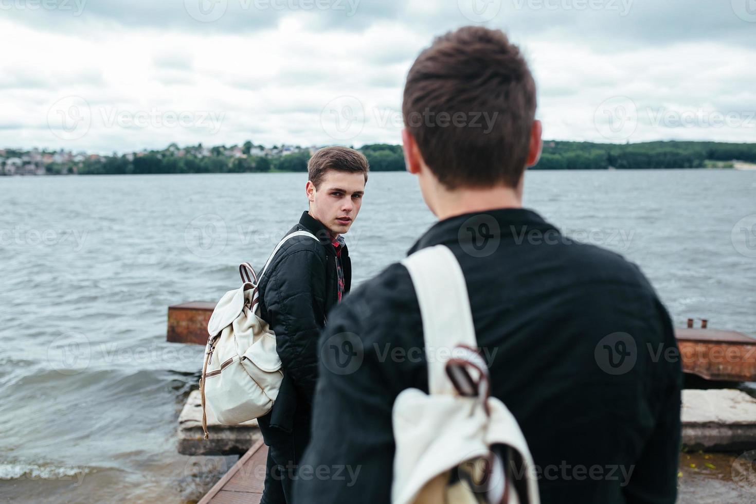two young guys standing on a pier 11756504 Stock Photo at Vecteezy two young guys standing on a pier 11756504 Stock Photo at Vecteezy
