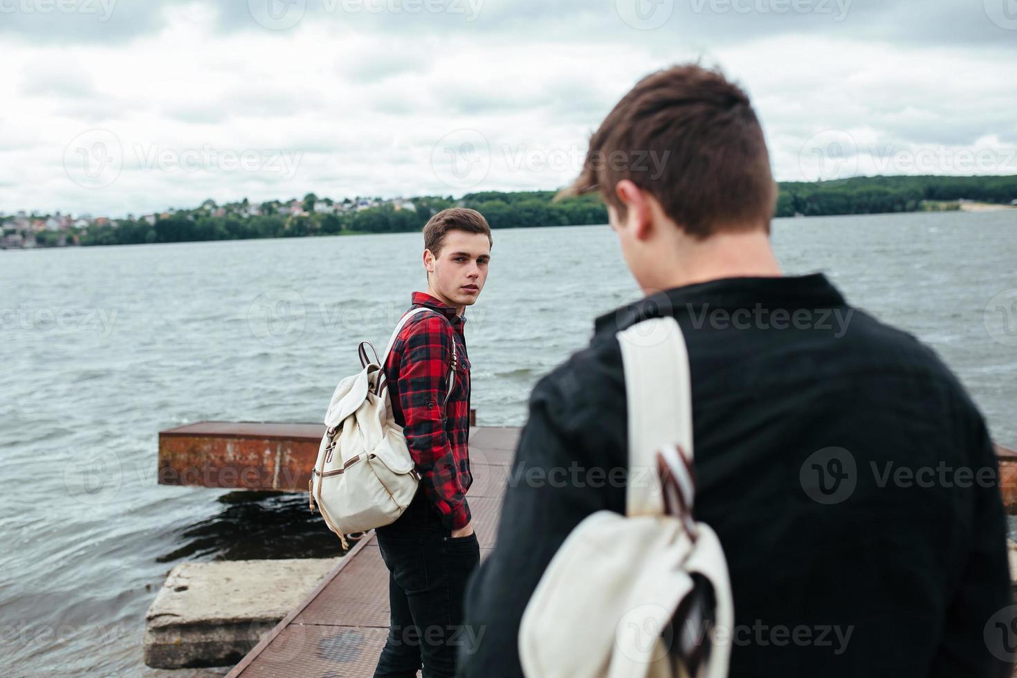 two young guys standing on a pier 11781960 Stock Photo at Vecteezy two young guys standing on a pier 11781960 Stock Photo at Vecteezy