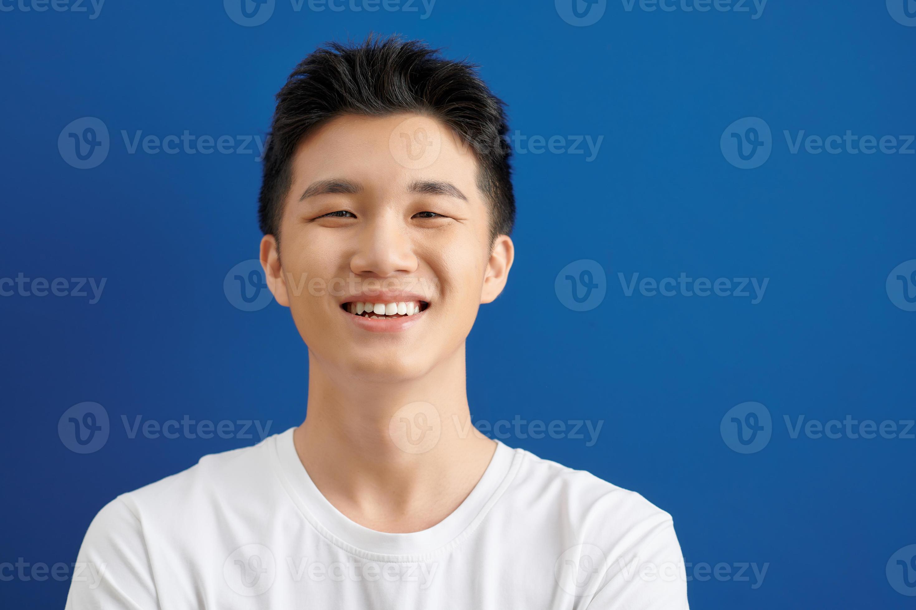 Young man face arms crossed with smiling face. Asian man standing ...