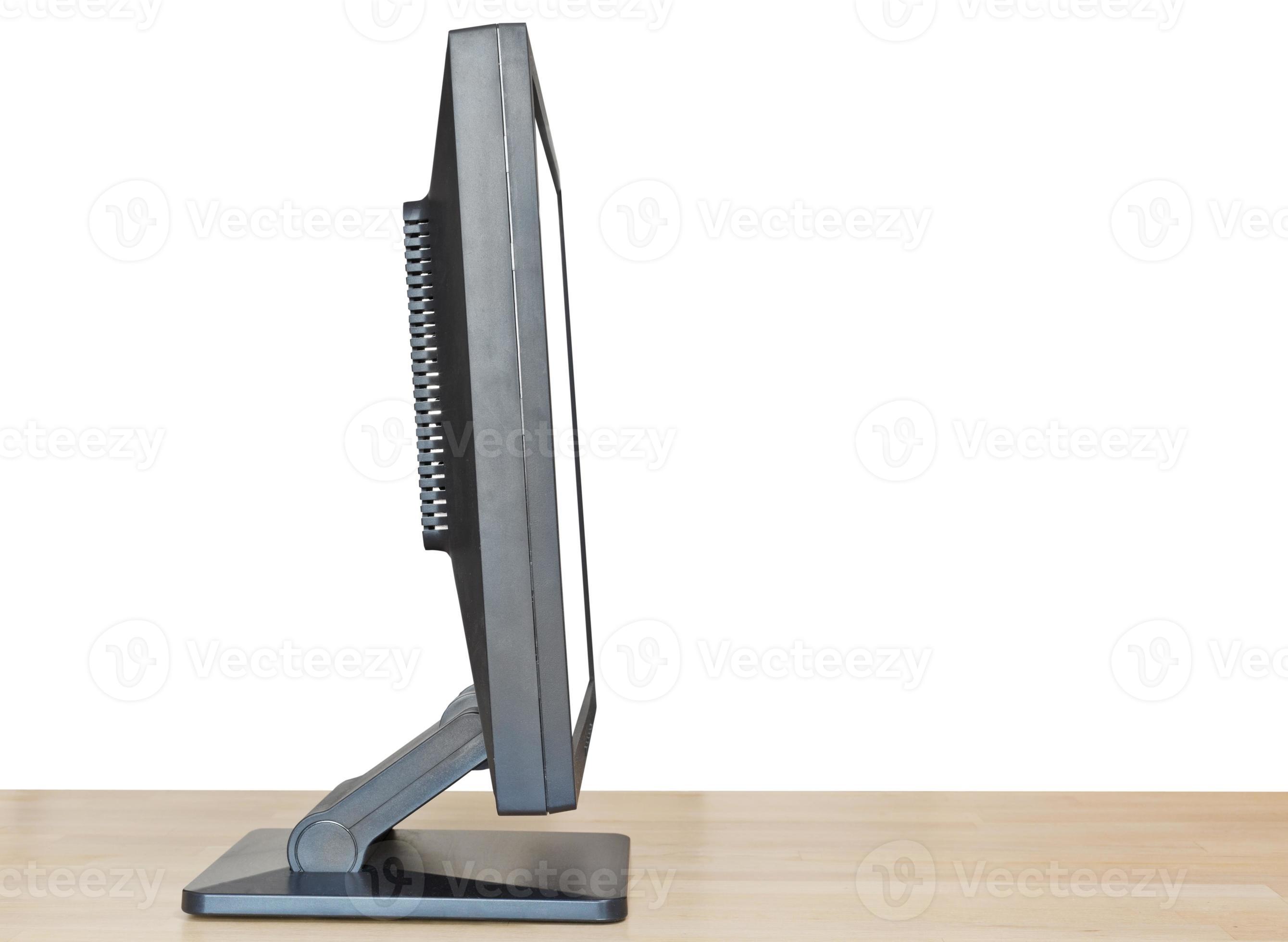 side view of computer display on table 11850566 Stock Photo at Vecteezy
