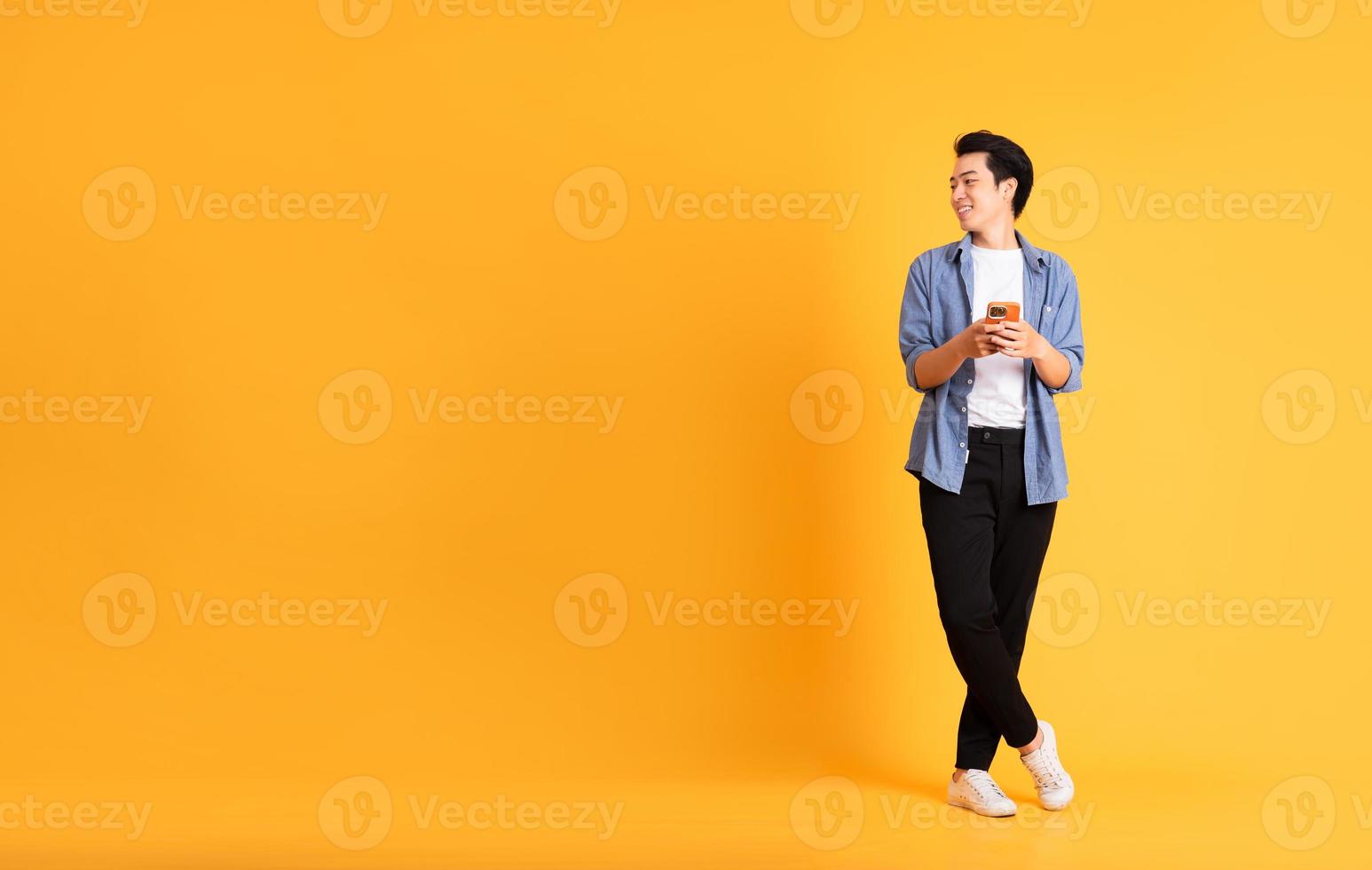 full body image of asian man posing on yellow background 11869344 Stock ...