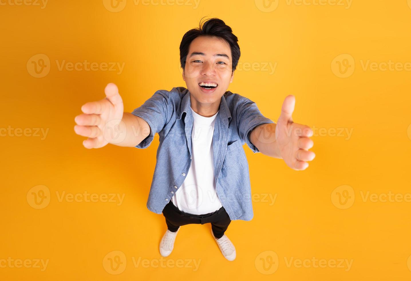 image of asian man posing on a yellow background 11869353 Stock Photo ...