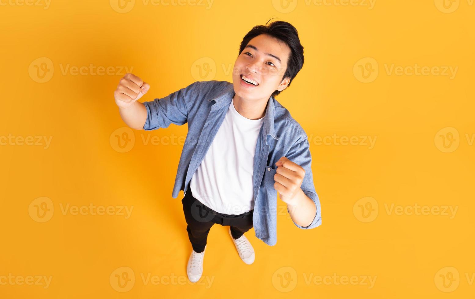 image of asian man posing on a yellow background 11869422 Stock Photo ...