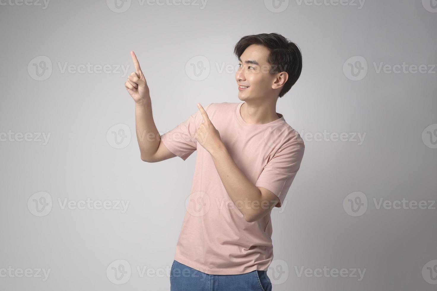 Portrait of young asian man over white background studio. 11881685 ...