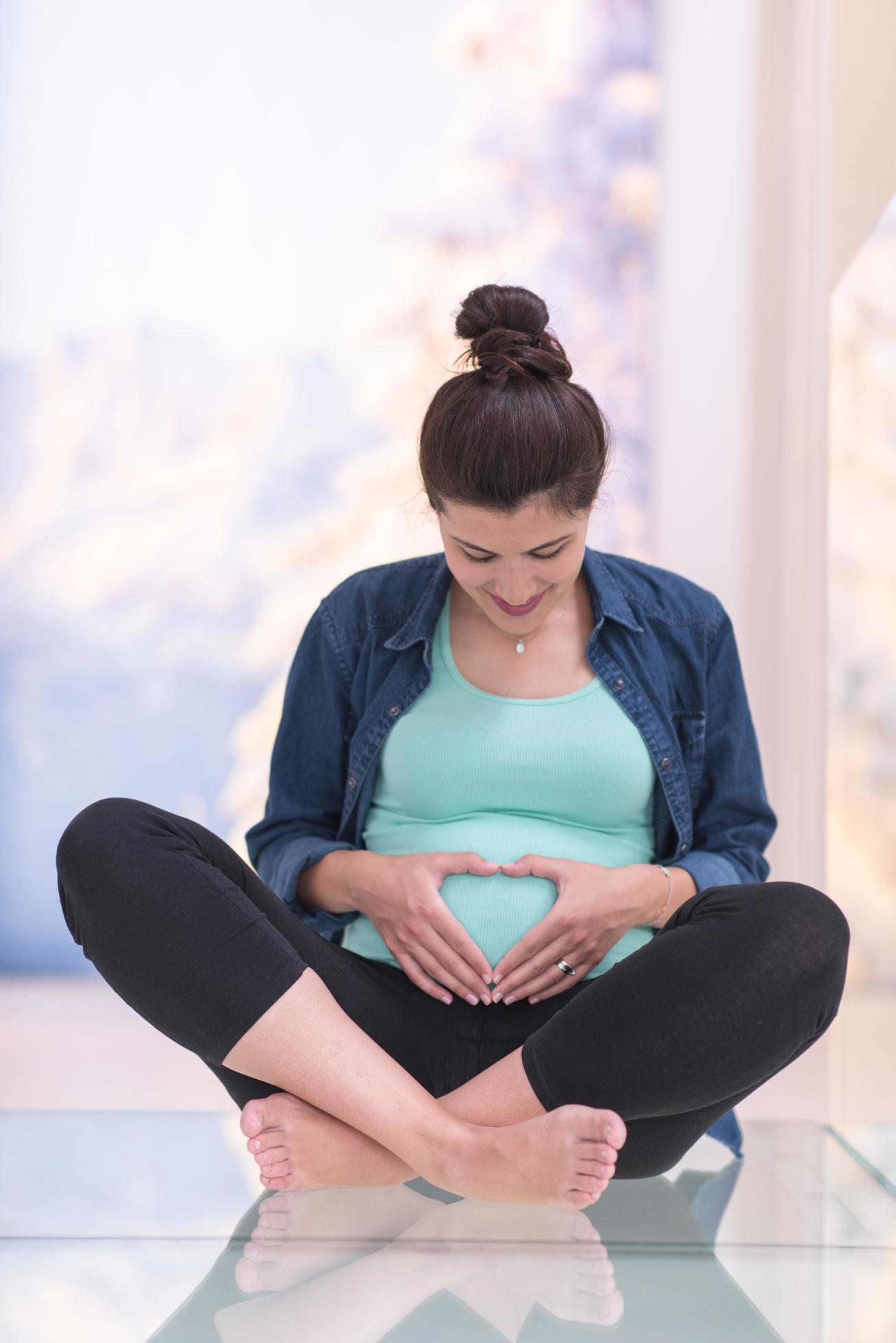 pregnant women sitting on the floor 11928039 Stock Photo at Vecteezy