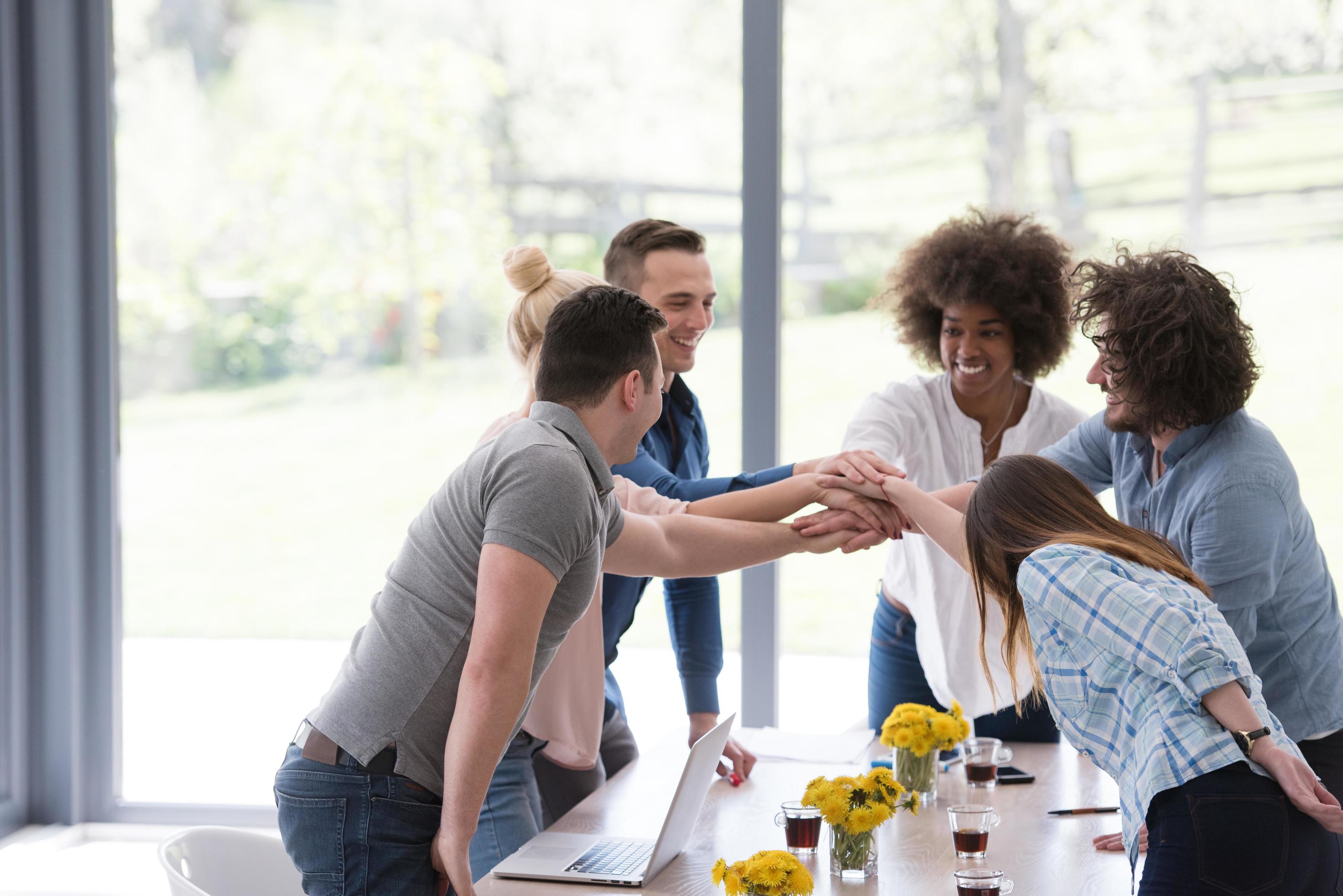 multiethnic startup Group of young business people celebrating success ... multiethnic startup Group of young business people celebrating success ...