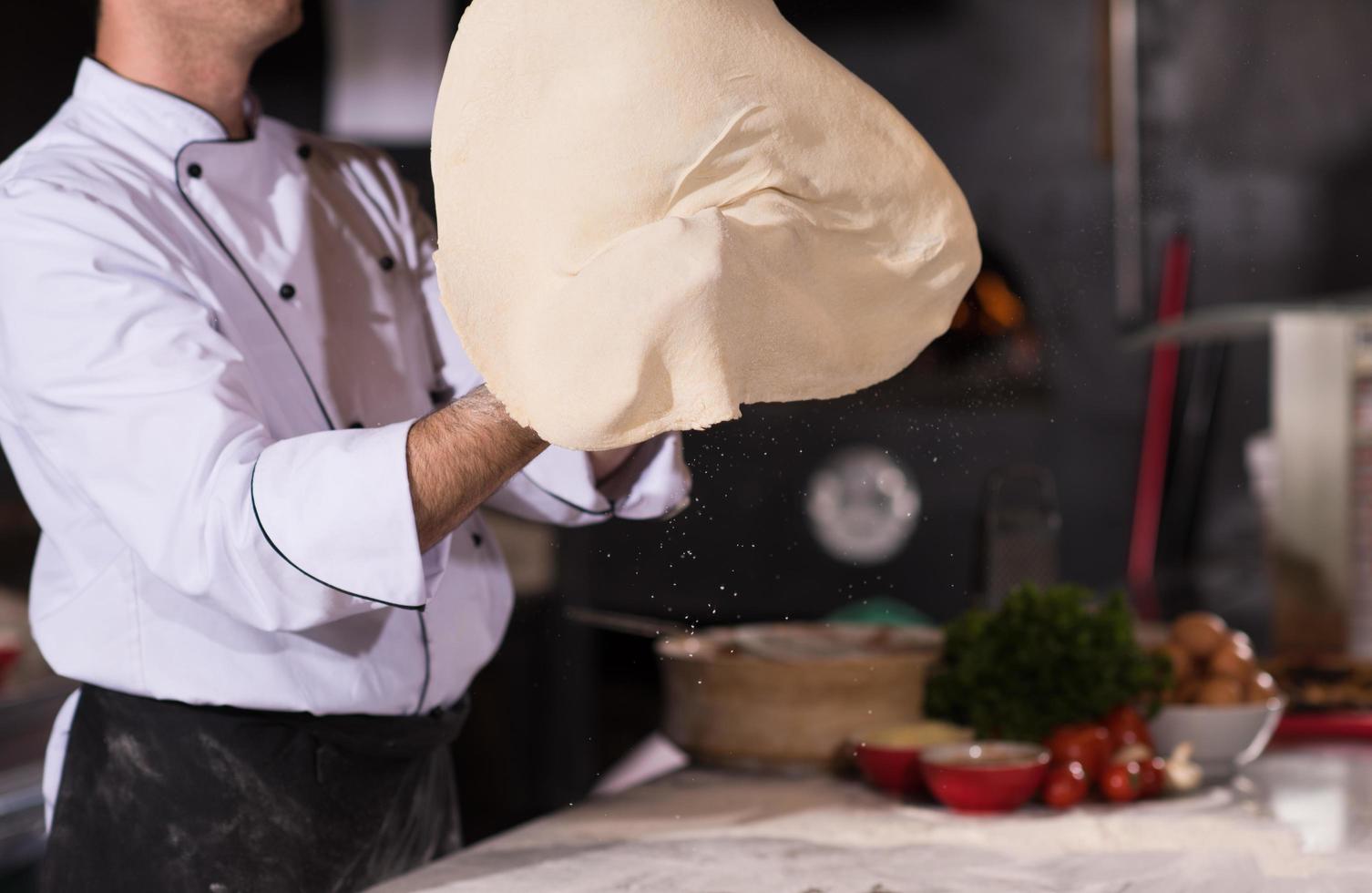 chef throwing up pizza dough 12092949 Stock Photo at Vecteezy