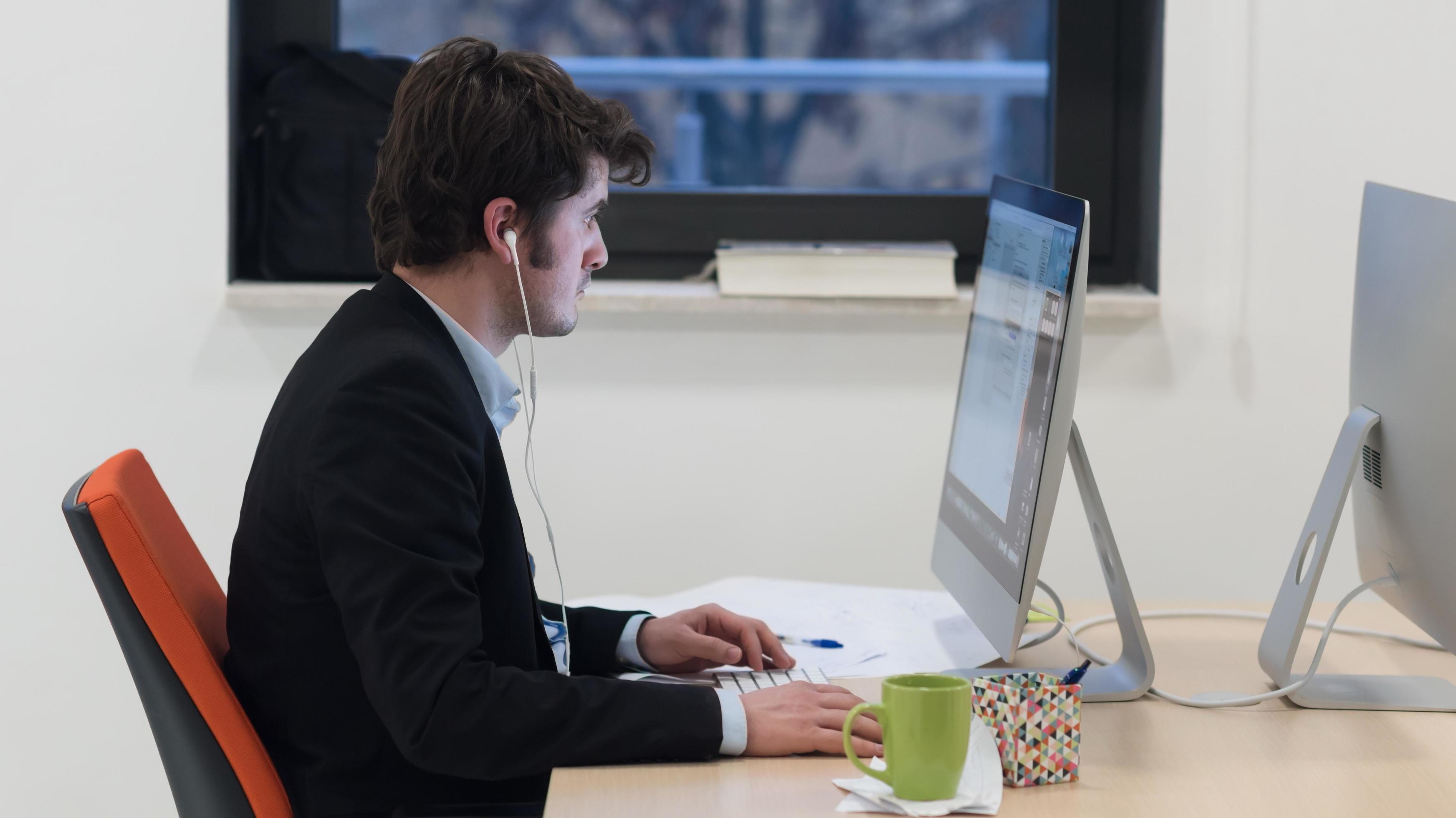 startup business, software developer working on desktop computer ...