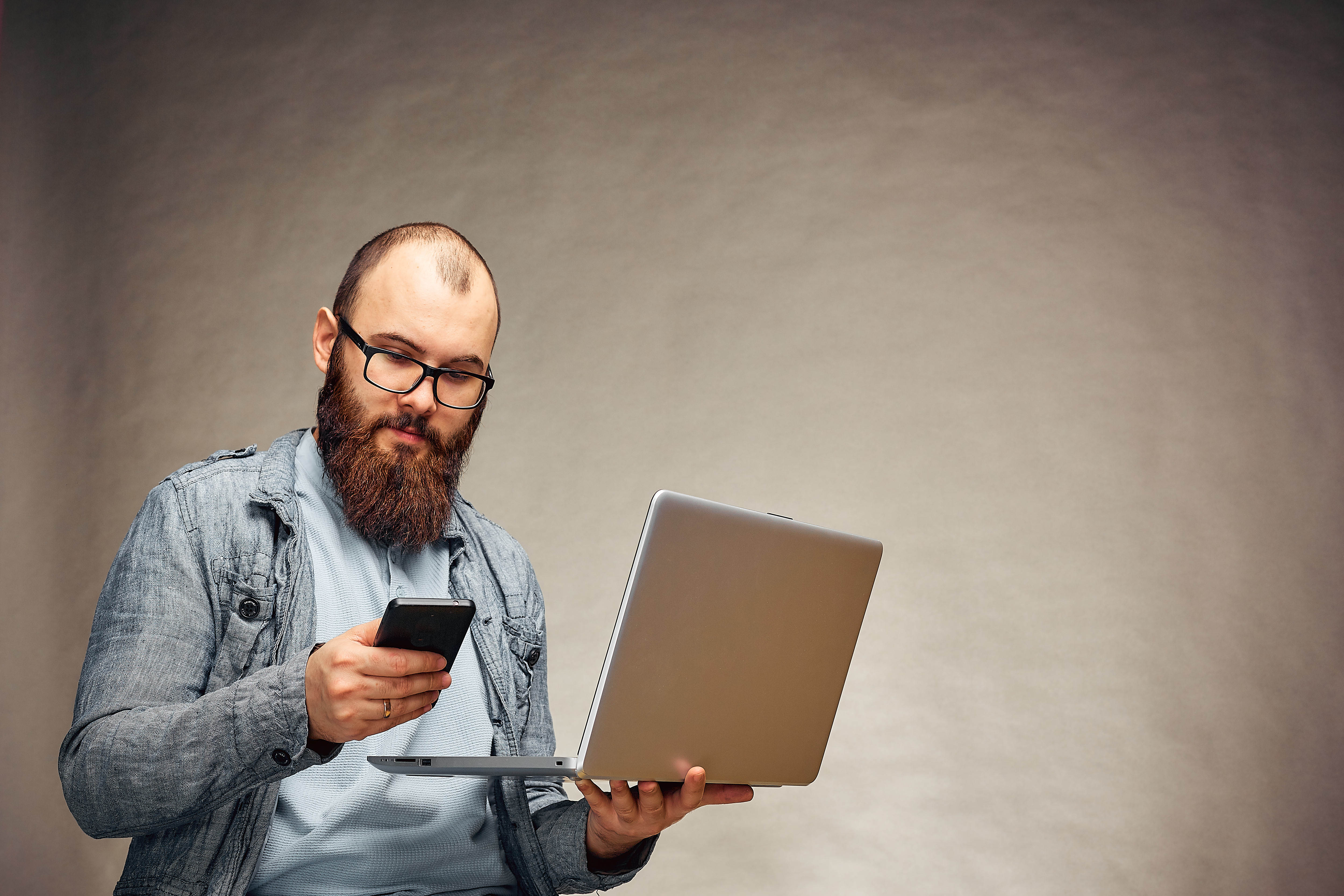 Man Holding Mobile Stock Photos, Images and Backgrounds for Free Download