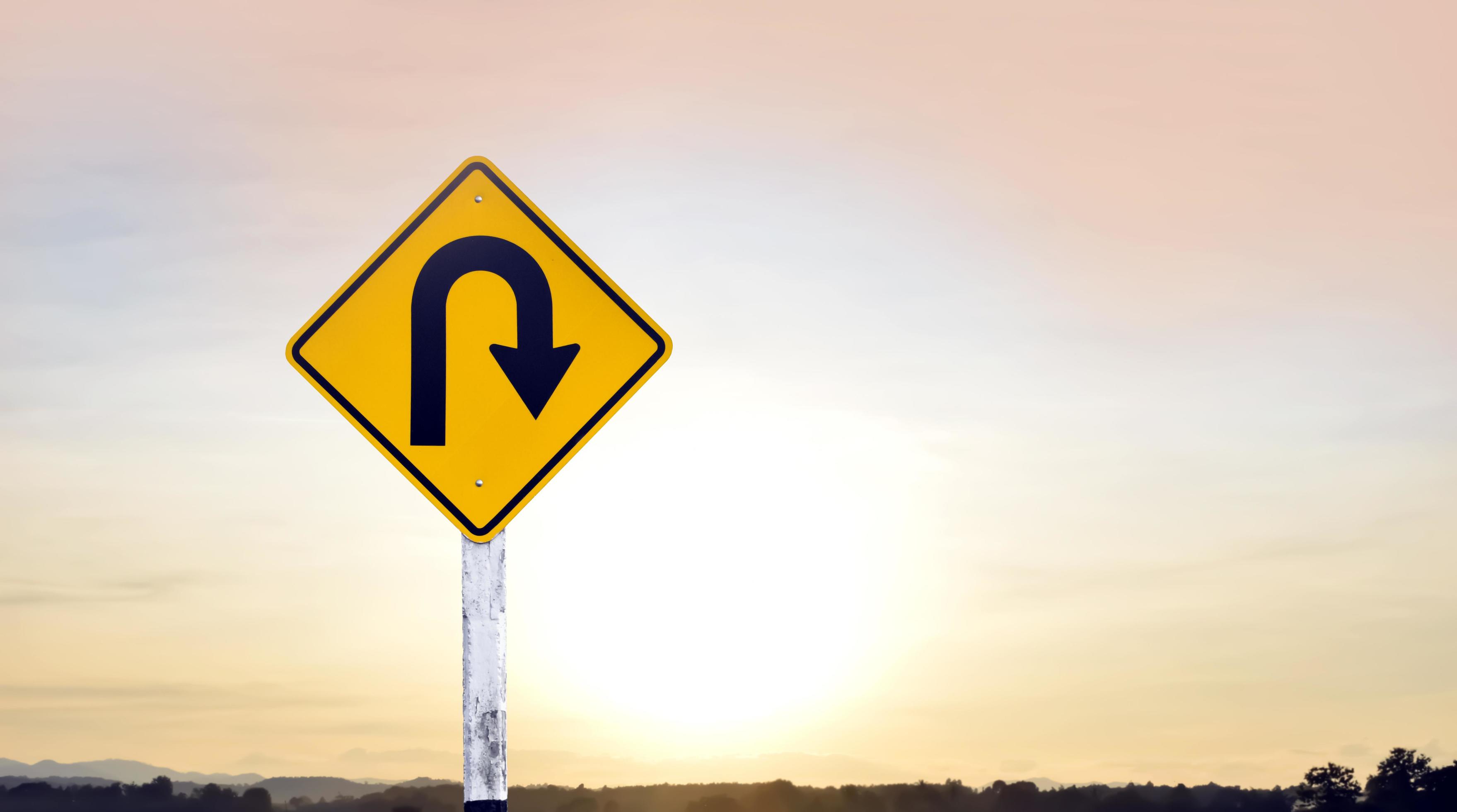 Right u-turn sign on pole, concept for traffic sign at night. 12130434 Stock Photo at Vecteezy