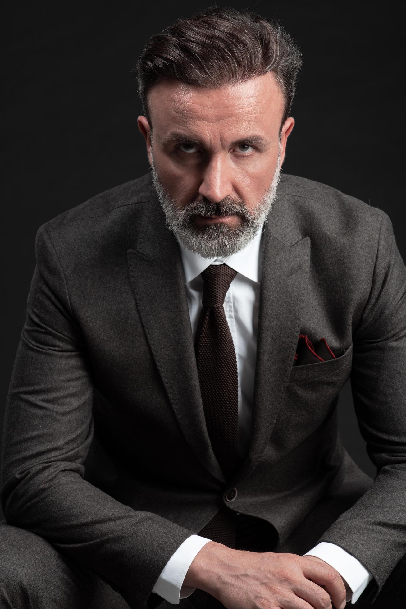 Portrait Of A Stylish Elegant Senior Businessman With A Beard And portrait-of-a-stylish-elegant-senior-businessman-with-a-beard-and