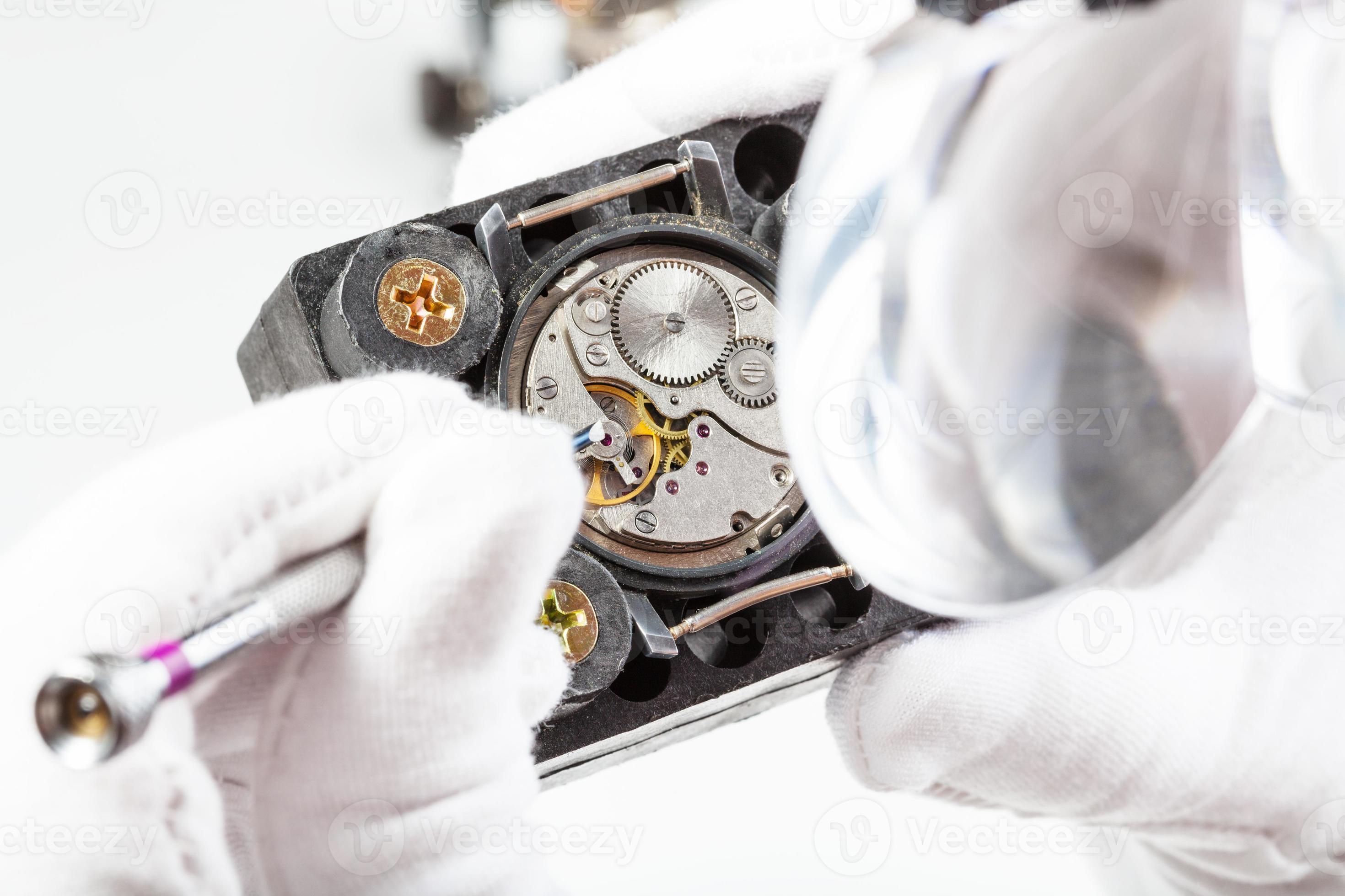 watchmaker in head-mounted magnifier adjusts watch 12251959 Stock Photo ... watchmaker in head-mounted magnifier adjusts watch 12251959 Stock Photo ...