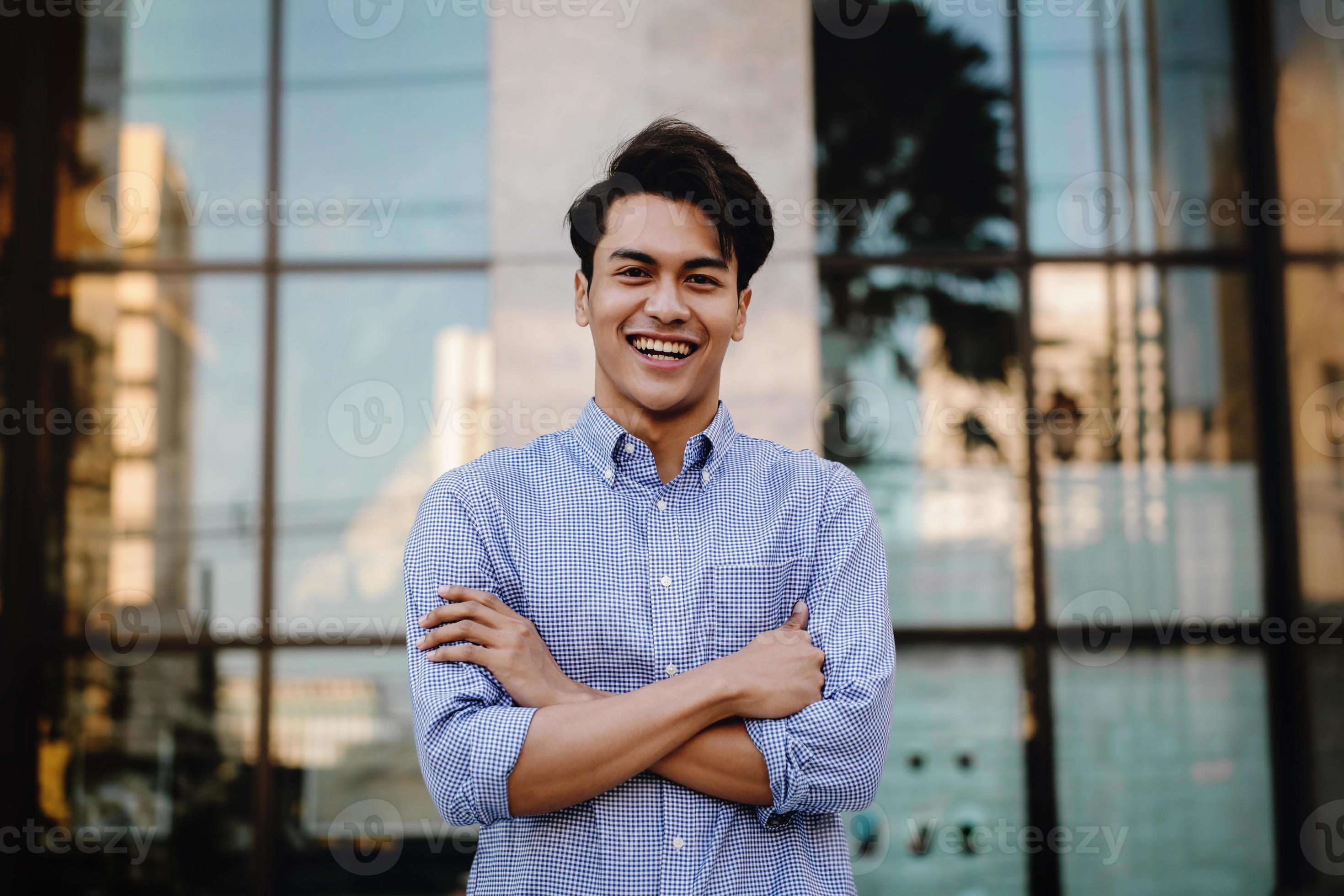 Happy Young Businessman Standing with a Big Smile in the City. Crossed ...
