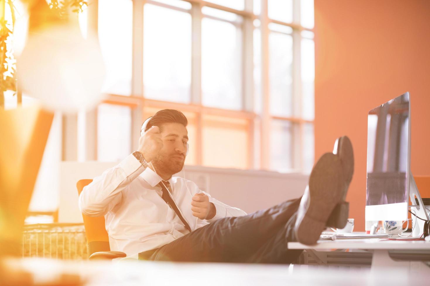 relaxed young businessman first at workplace at early morning 12441937 ...