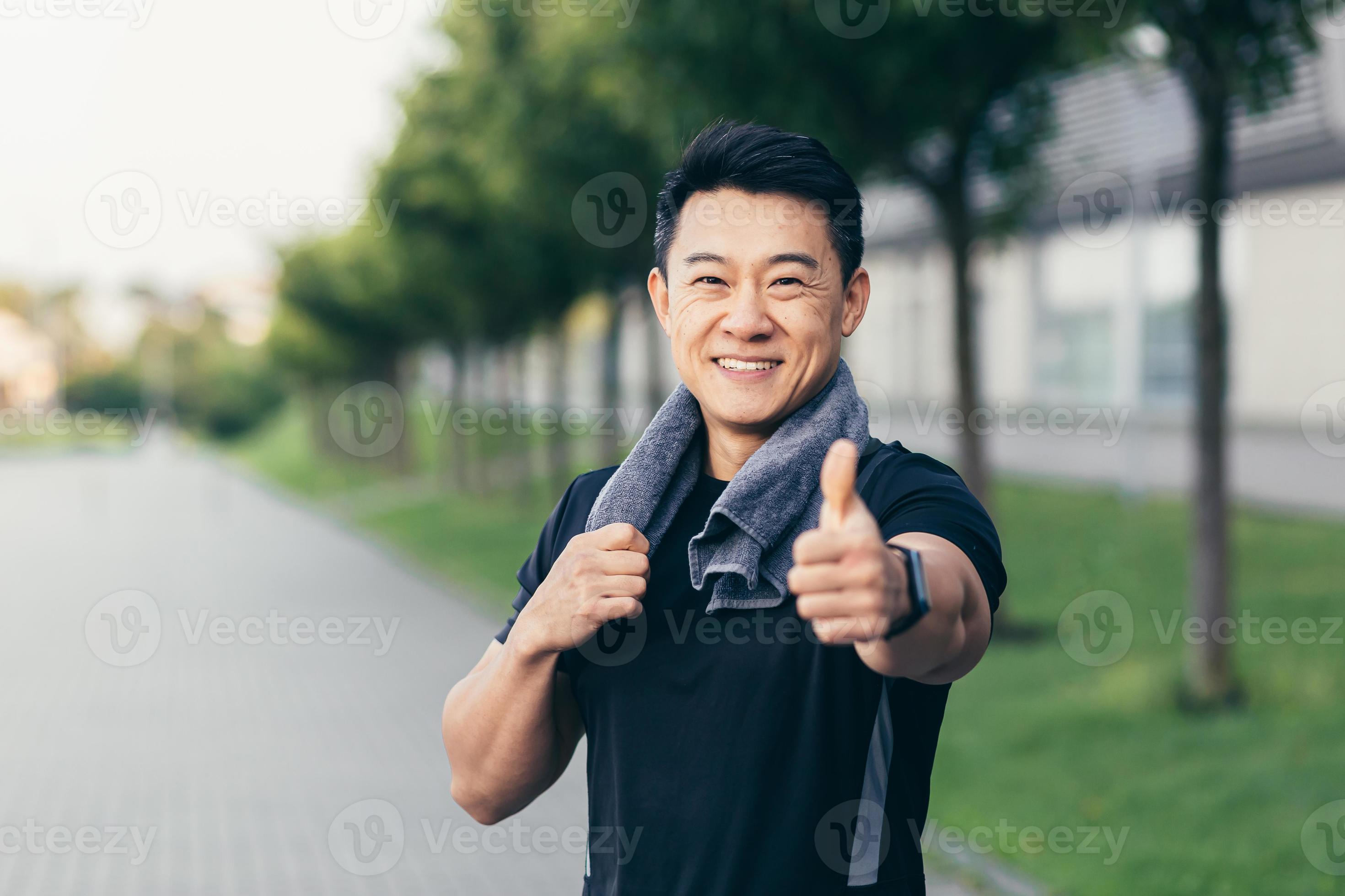 asian man after fitness workout and jogging happy man smiling shows ...