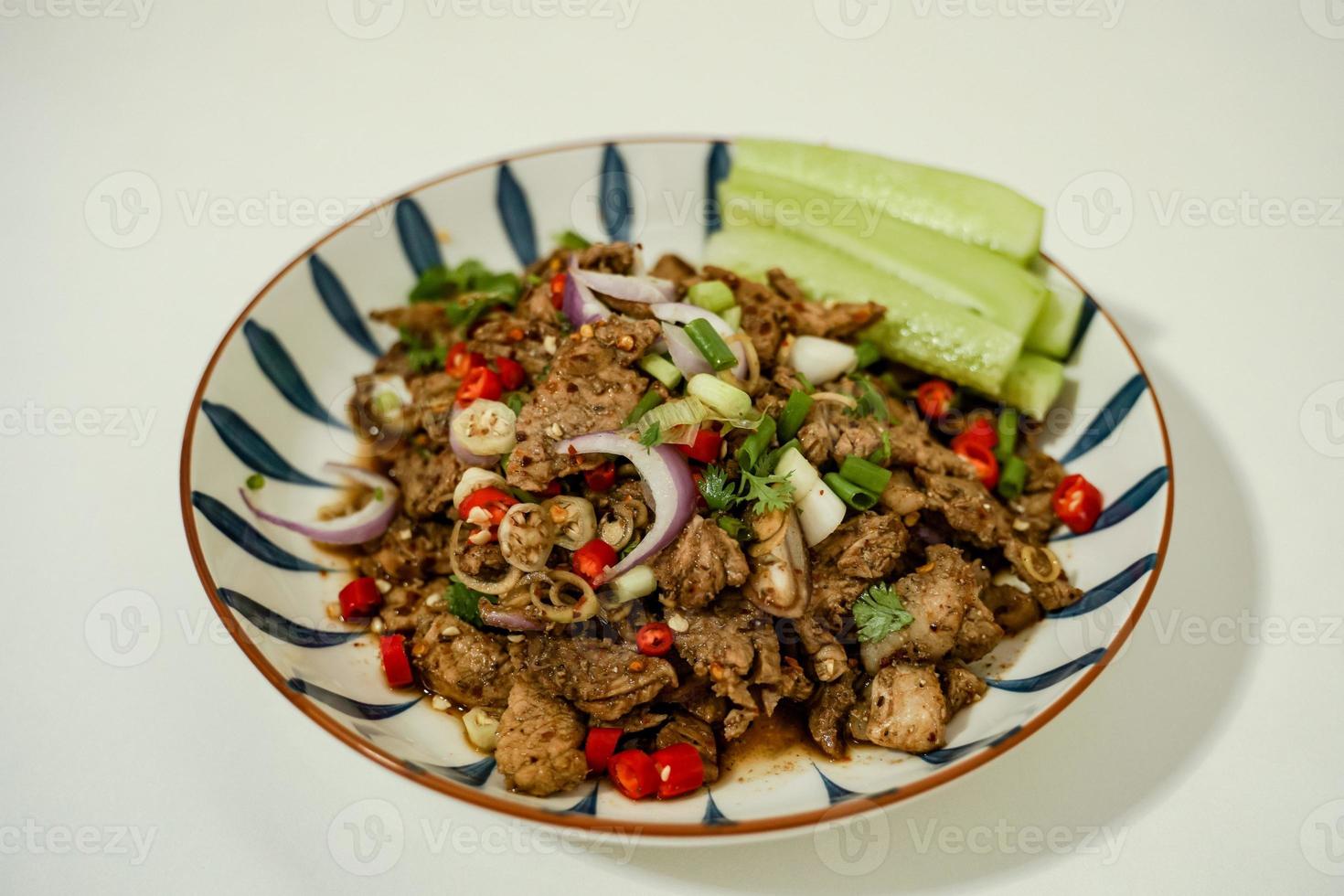 Spicy minced pork salad served with fresh vegetables Minced pork salad is a popular traditional ...